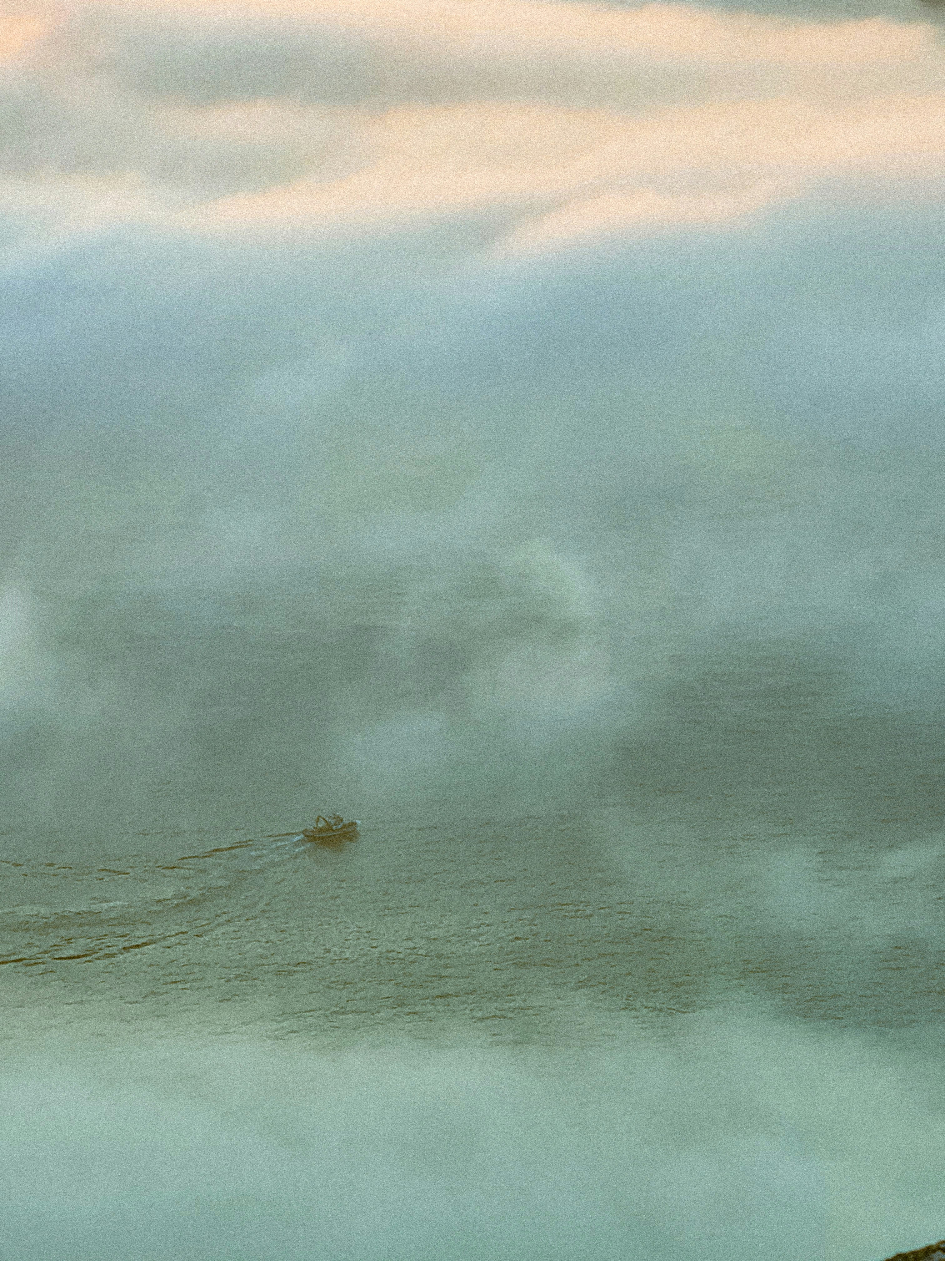 Lonely Vessel Drifting Through Misted Quiet