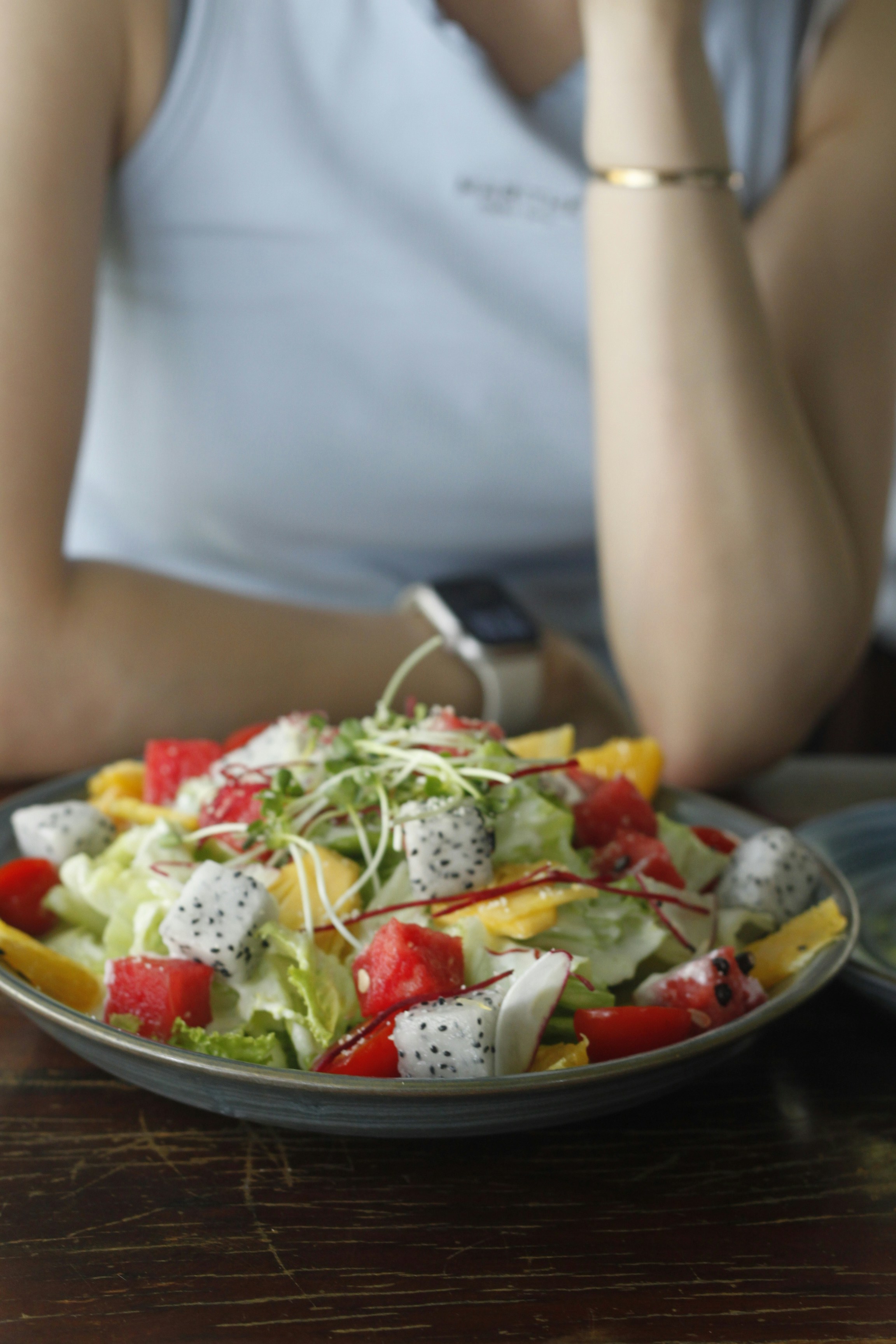 Fruit-Laden Bowl at the Table, With a Contemplative Presence