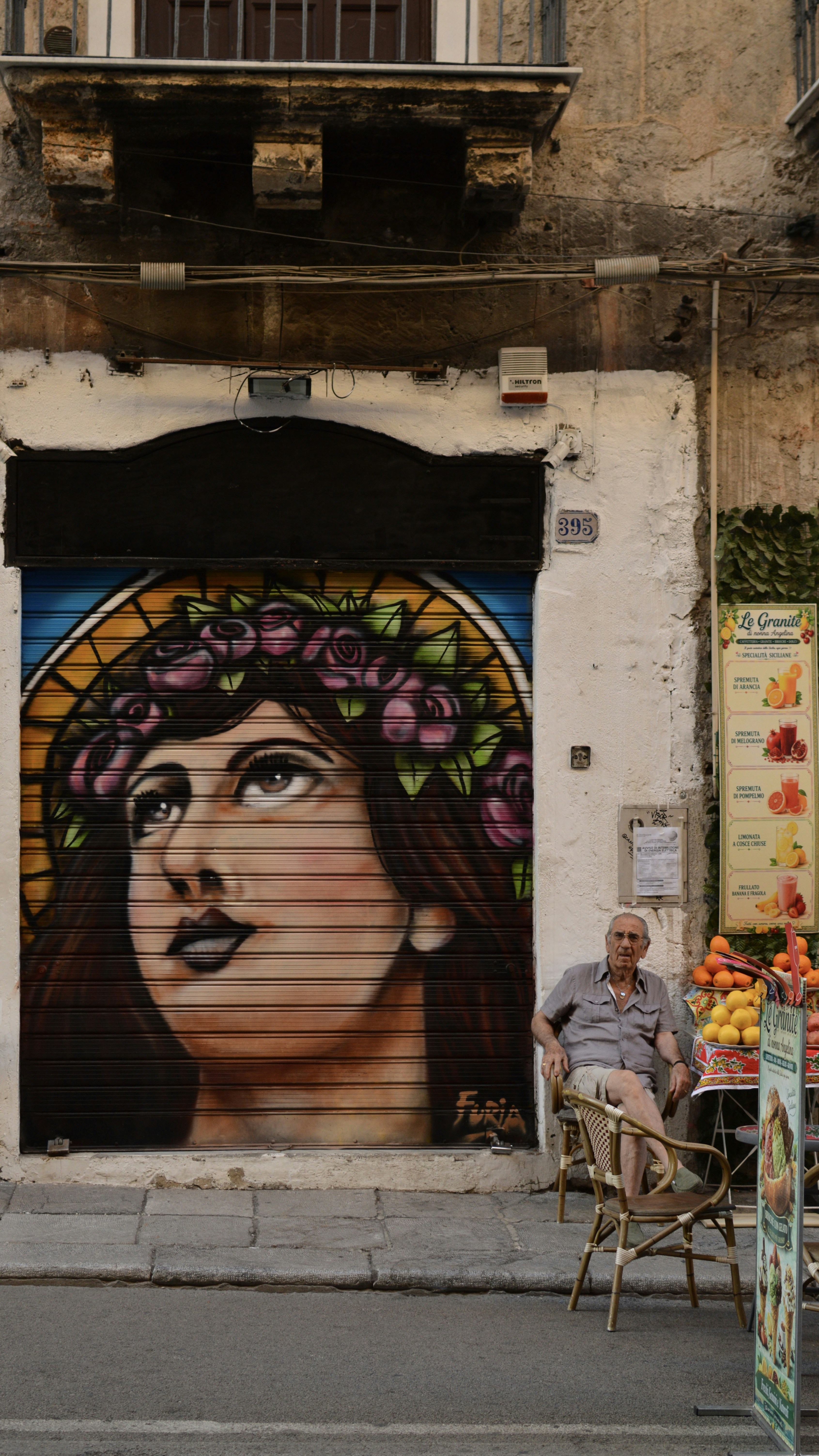 Graffiti Maiden and the Street Vendor: A Quiet Corner Portrait