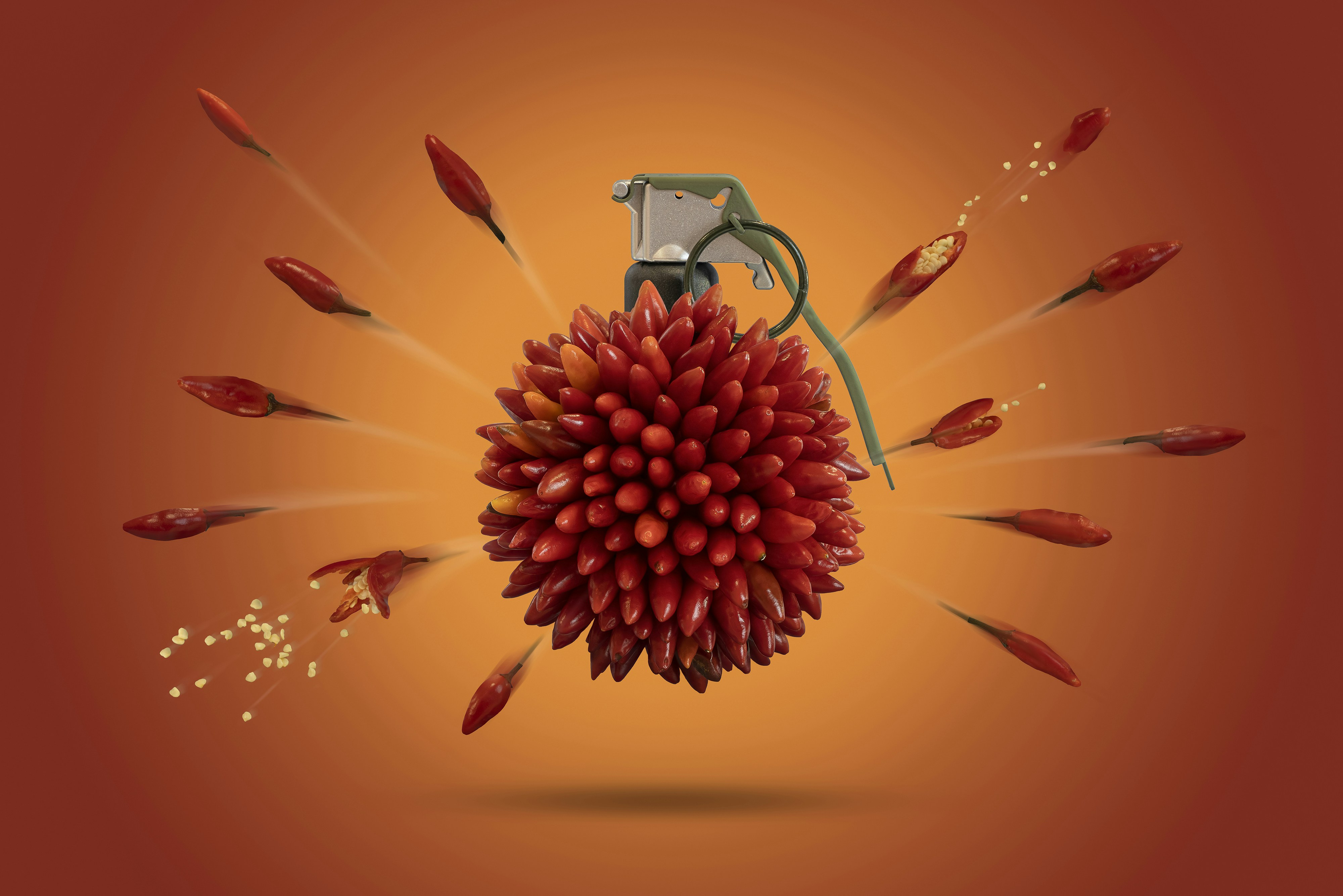 A hand grenade shaped like a cluster of red chili peppers exploding outward