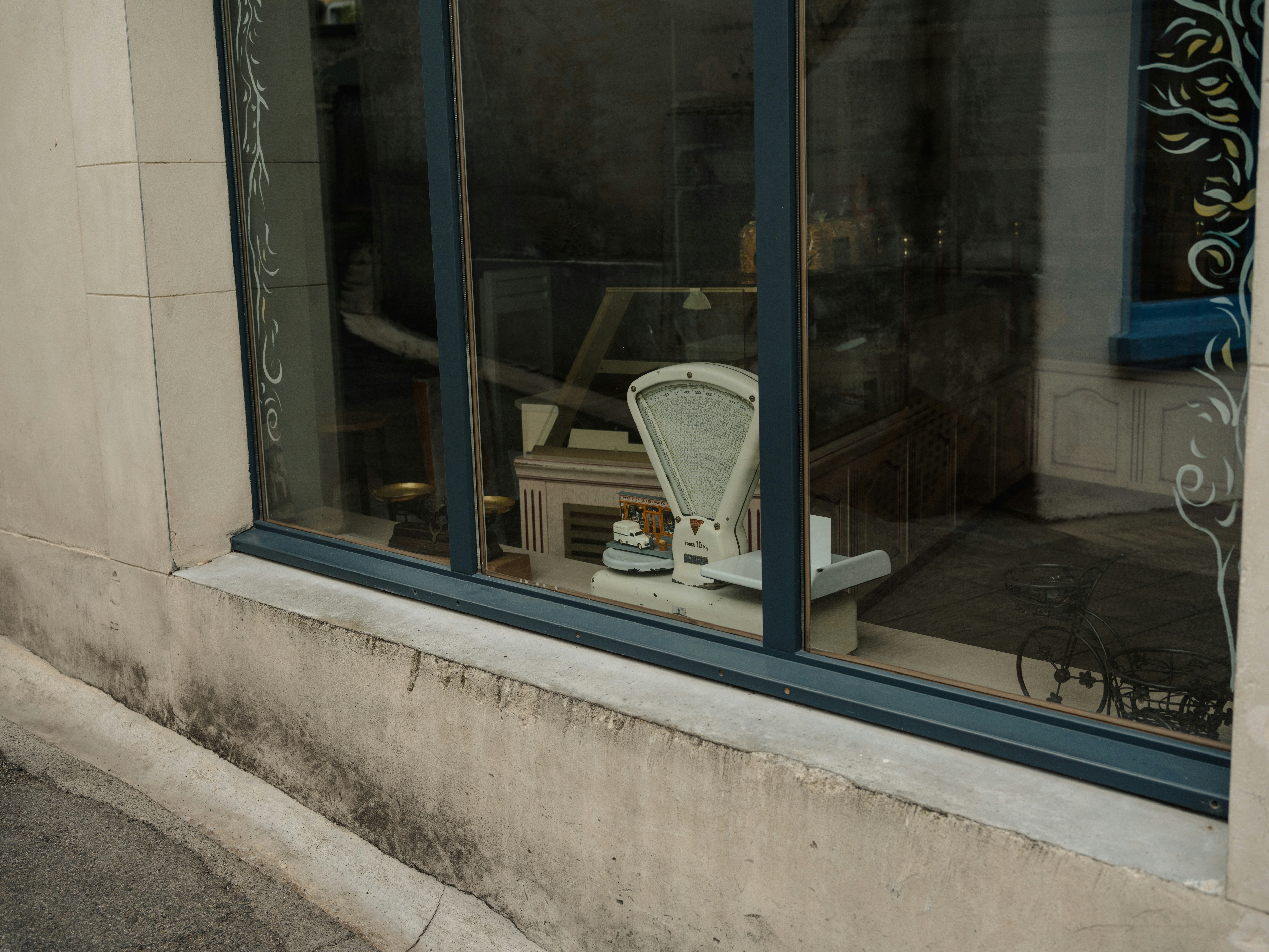 A Quiet Shopfront Scale-and-Window Display