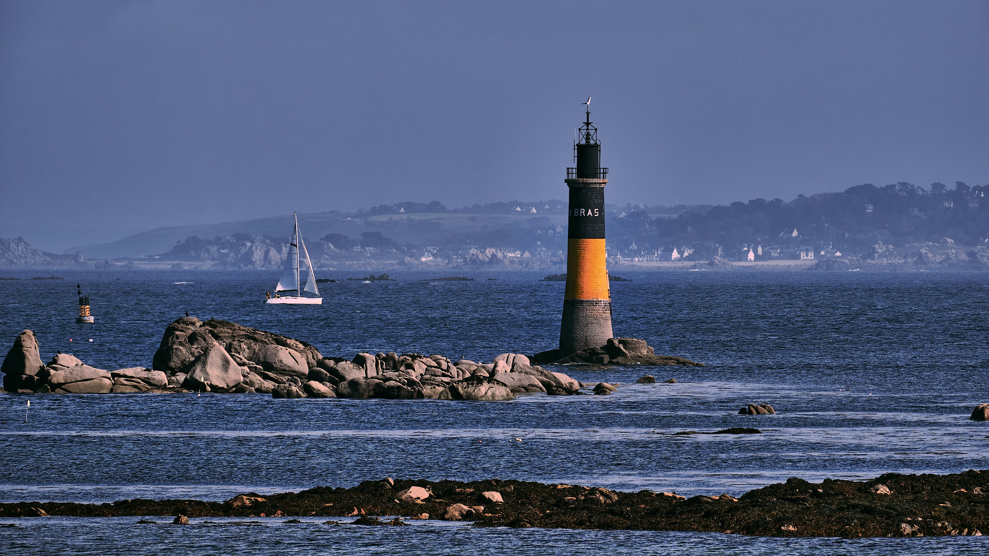 Lighthouse Sentinel Over Calm Waters
