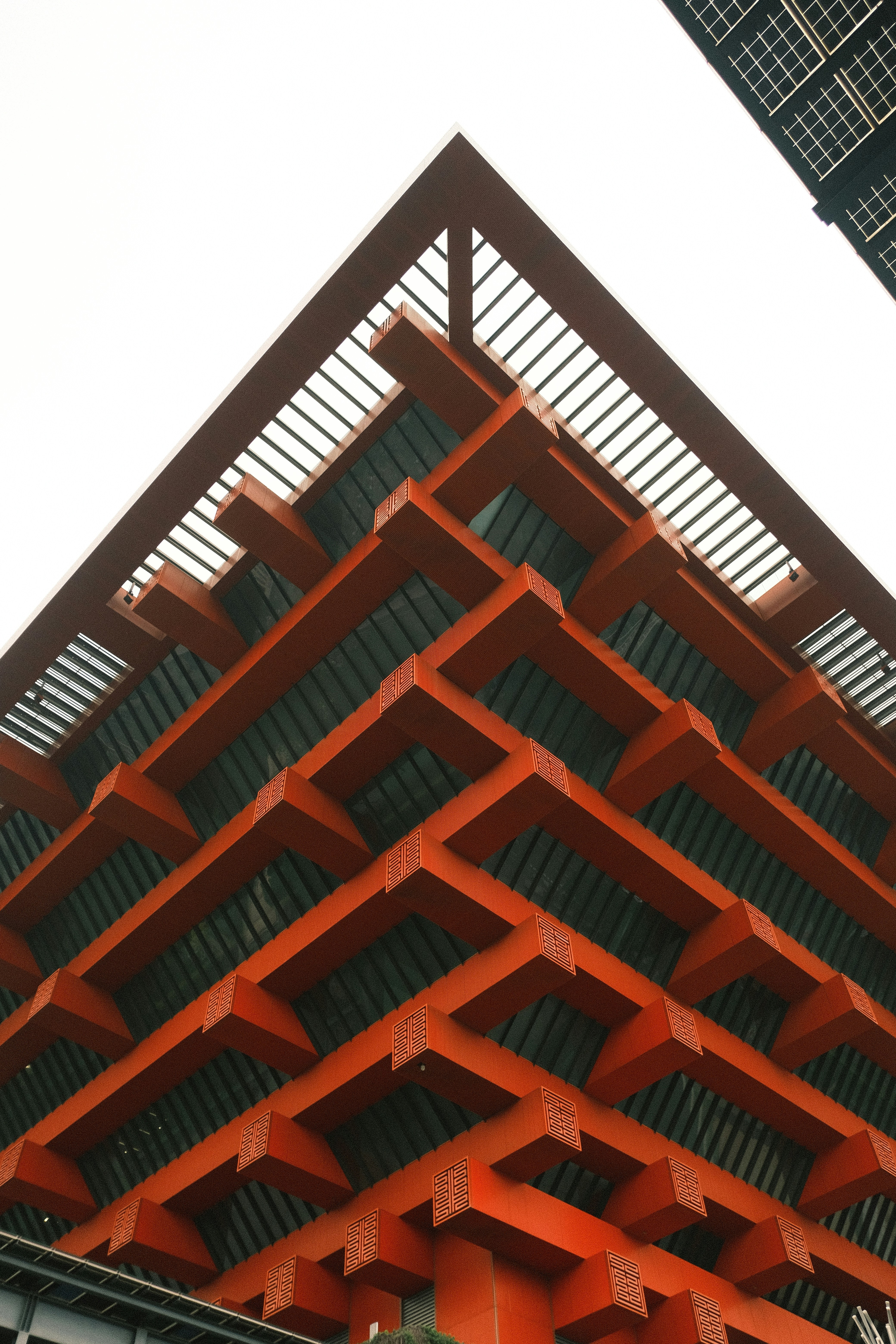 Red Geometric Staircase: A Bold Colonnade in Angular Symmetry