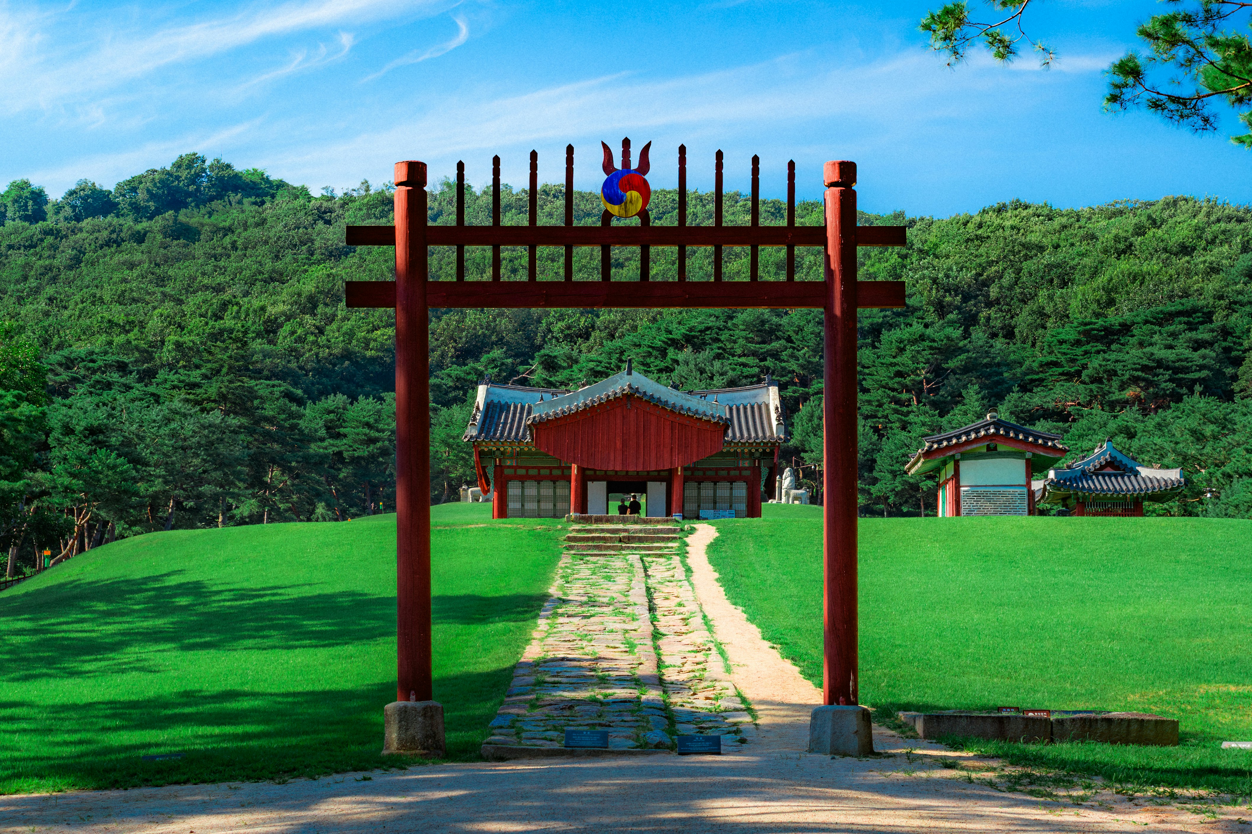 Gateway to Serenity: A Traditional Arch Framing a Sphinx of Steps