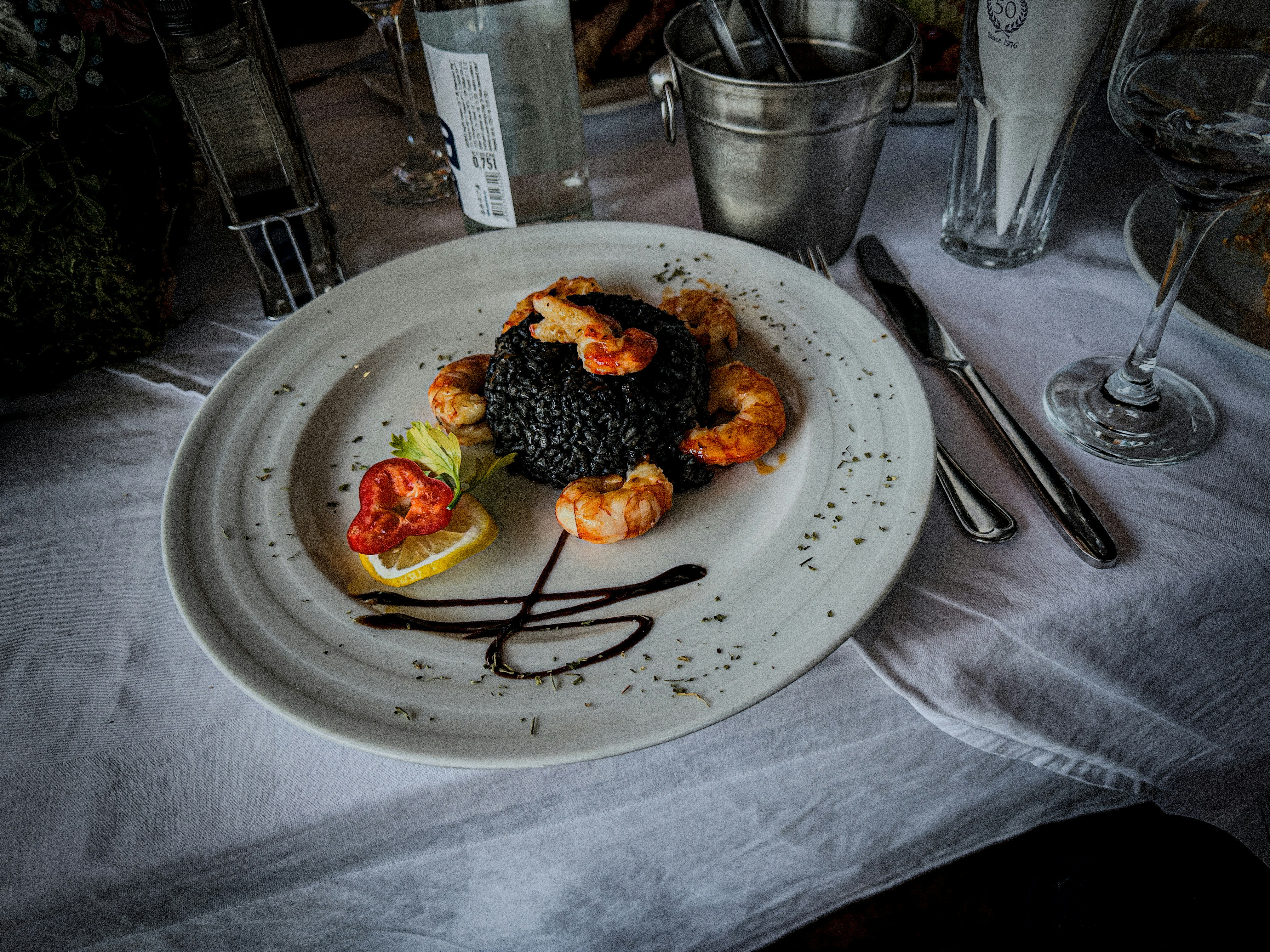 Charred plate centerpiece: a blackened seafood tower with citrus and chocolate drizzle