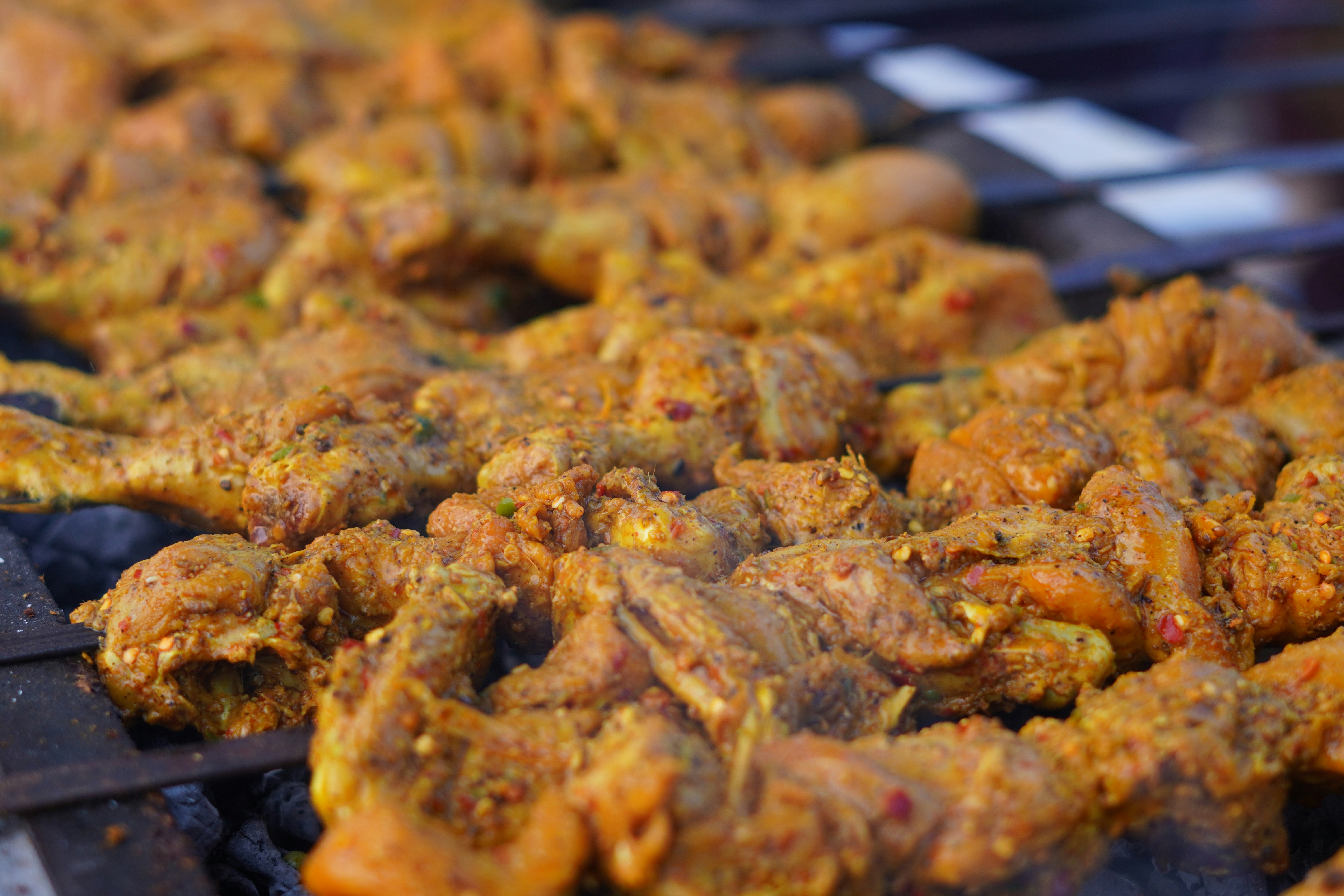 Charred Skewers on a Griddle: Flame-Kissed Kebabs in a Busy Grill