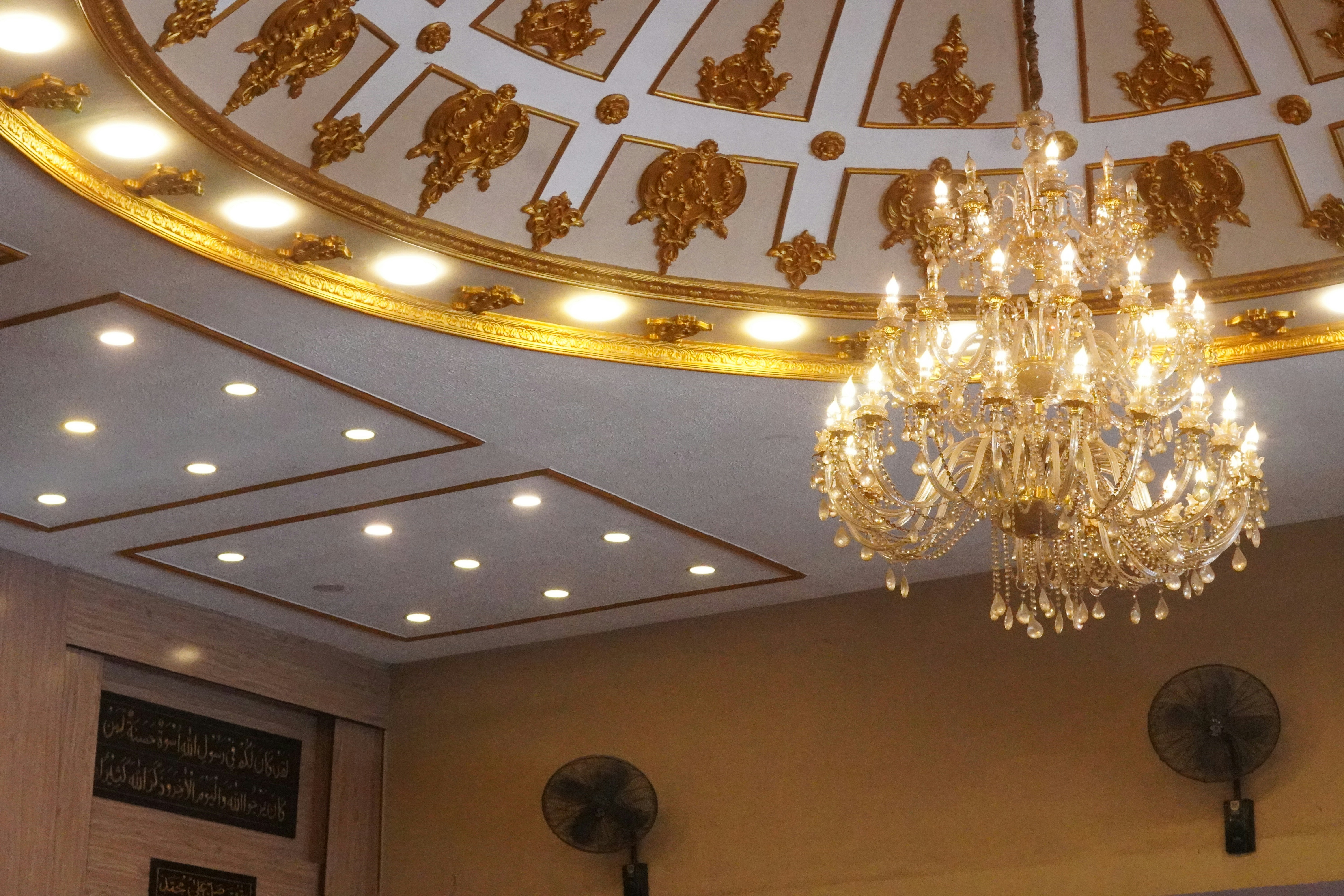 Crystal Crown: Ornate Ceiling and Chandeliers in a Grand Hall