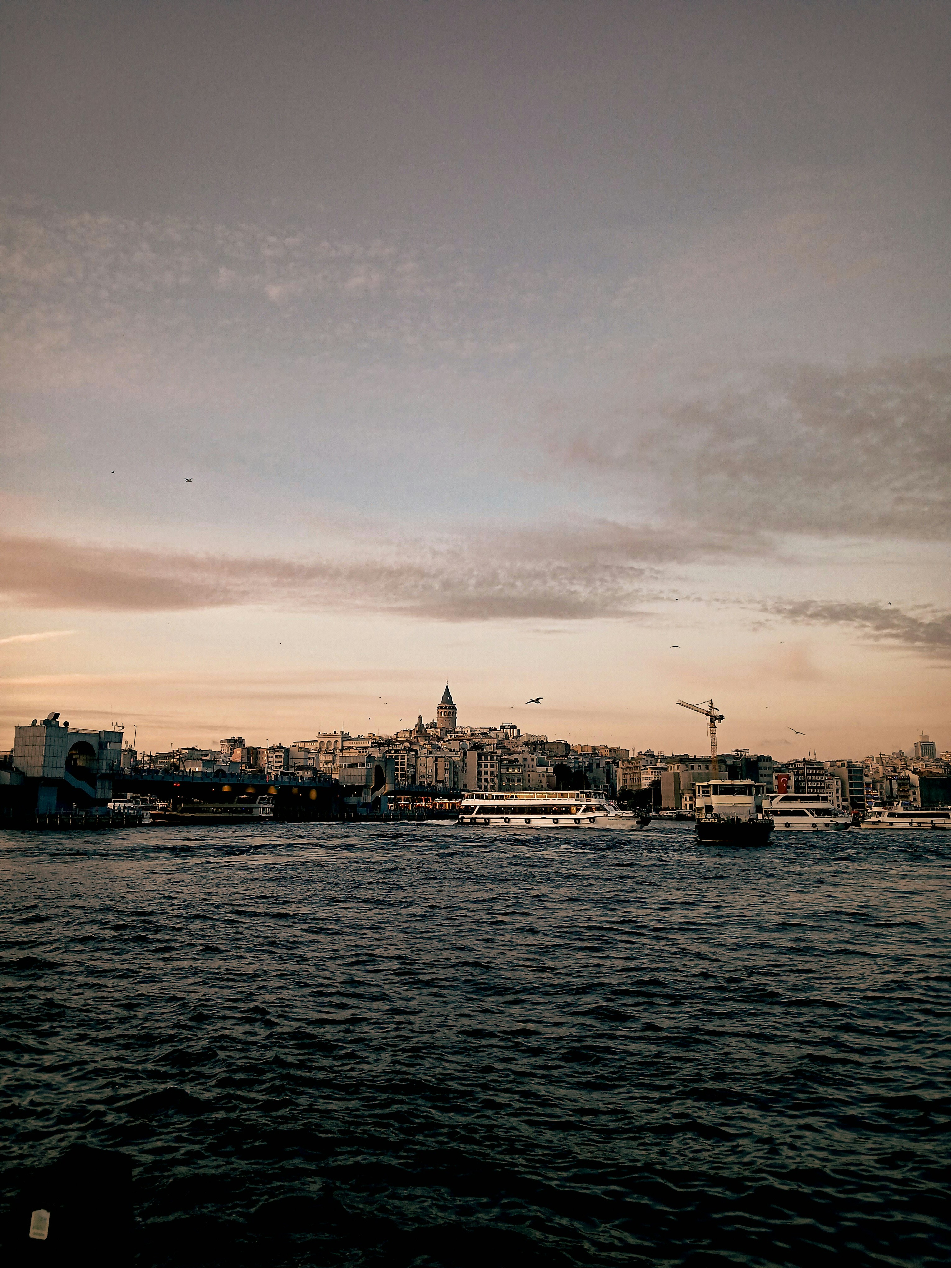 Harbor Silhouette at Dusk: Cityscape over Gentle Waters