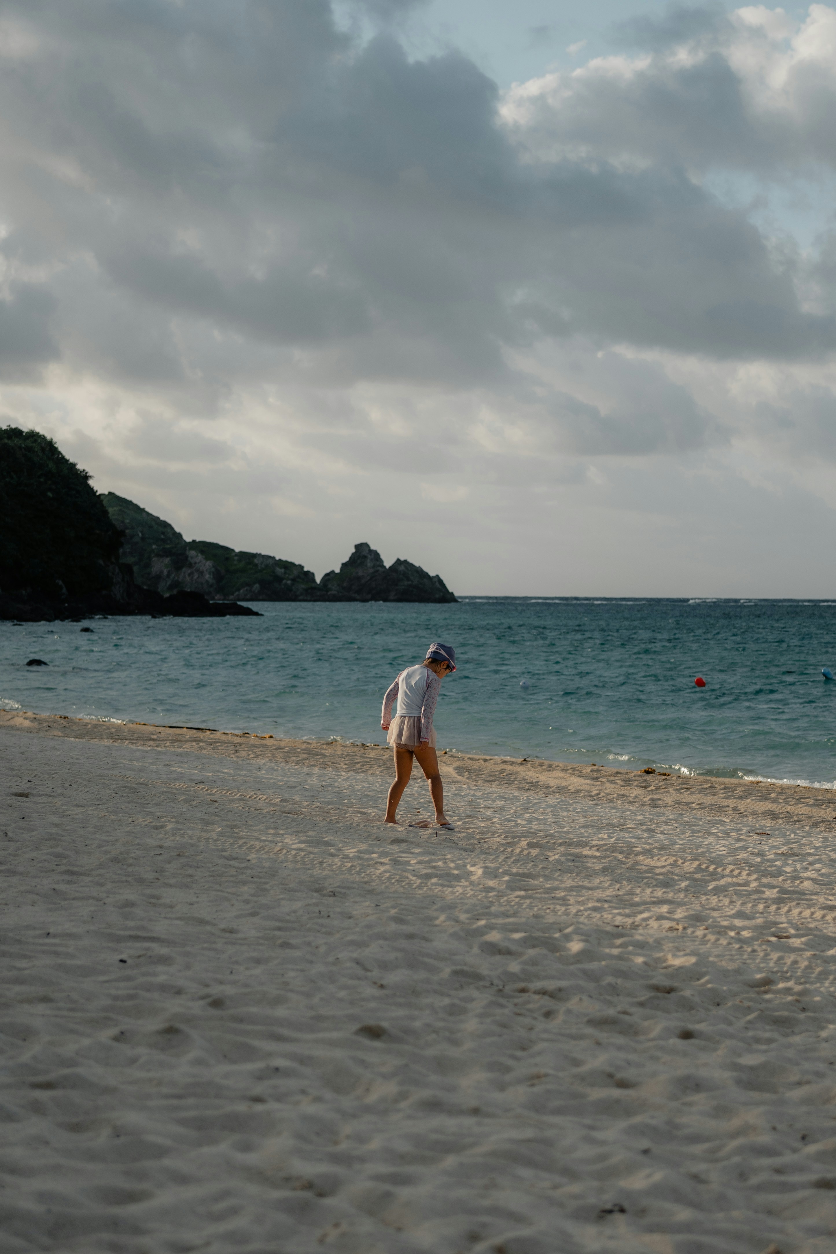 Footsteps on a Quiet Beach: A Solitary Stroll at Dusk