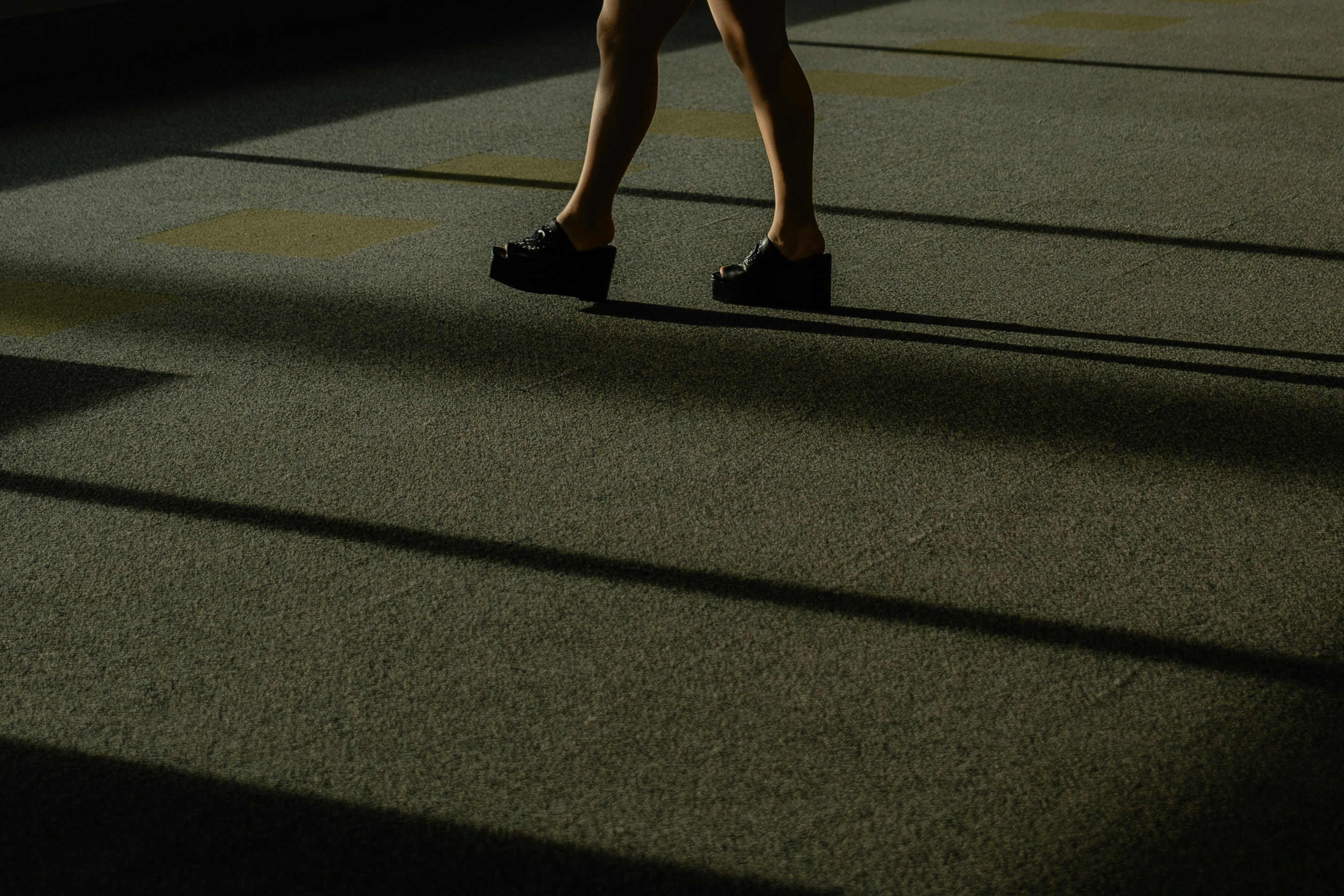 Shadowed Stride: A Runner’s Silhouetted Pause