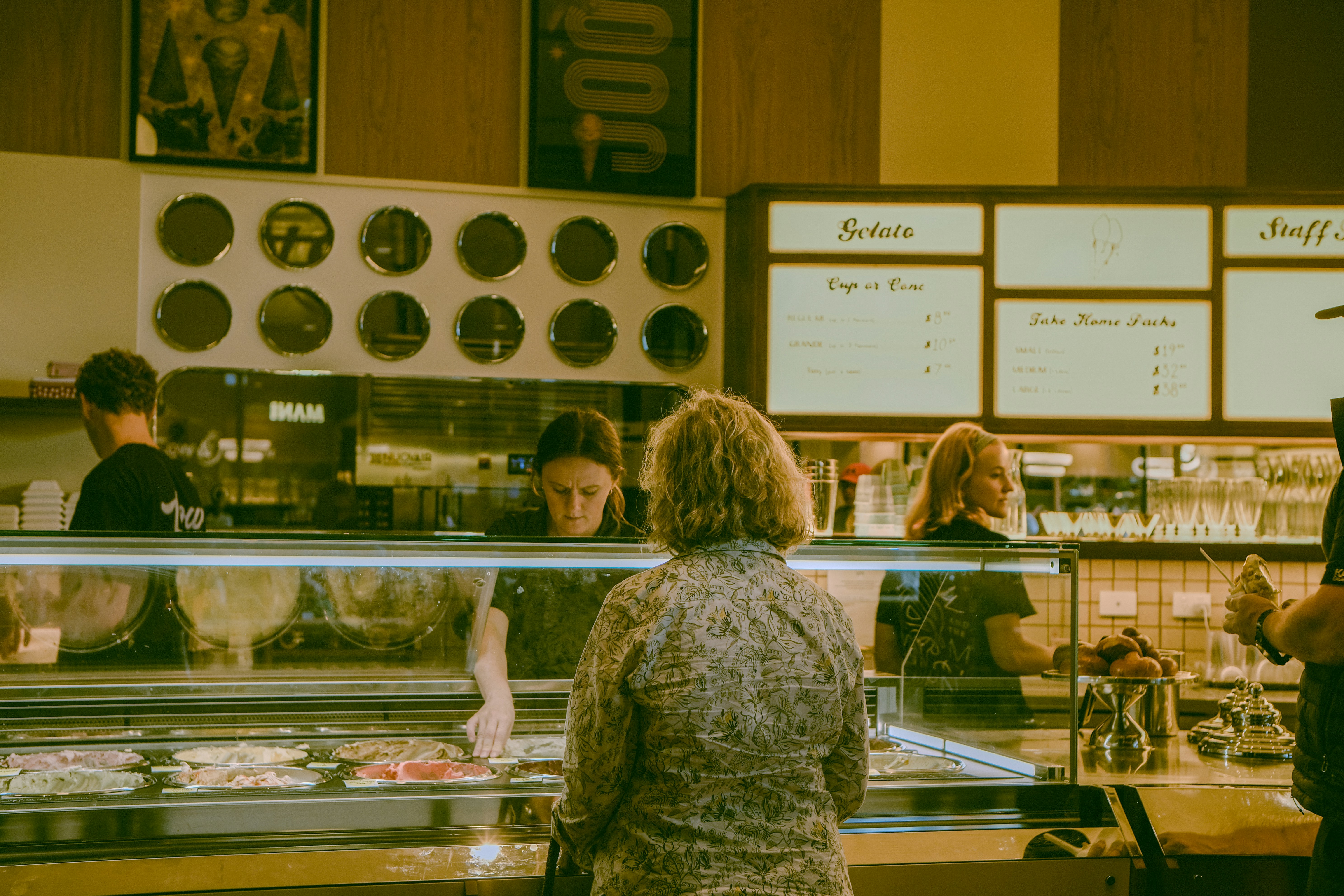 Sticky Glass, Warm Lights: A Quiet Moment at the Deli Counter