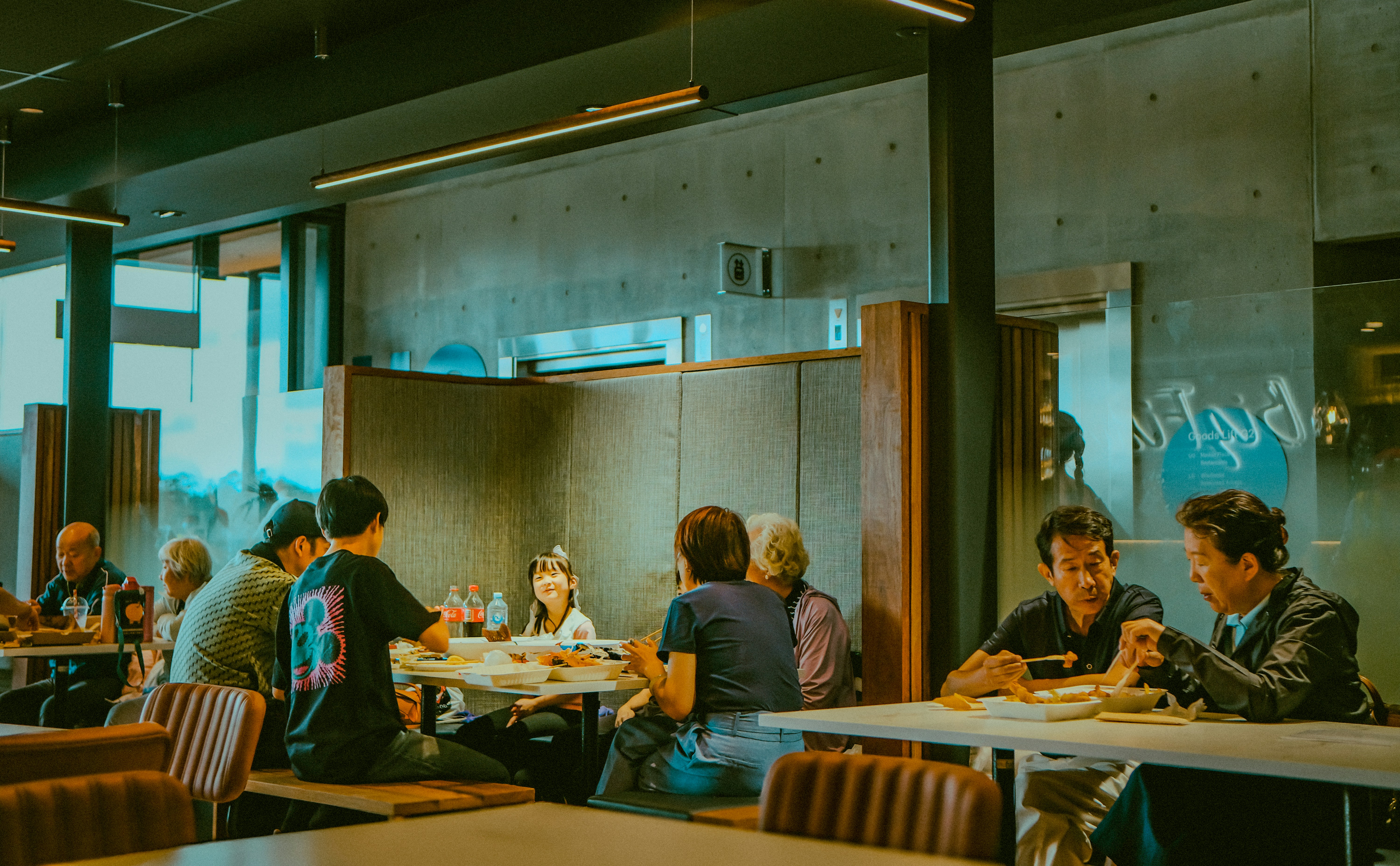 Table Talk in a Modern Café: Quiet Conversations Amid Concrete and Glass
