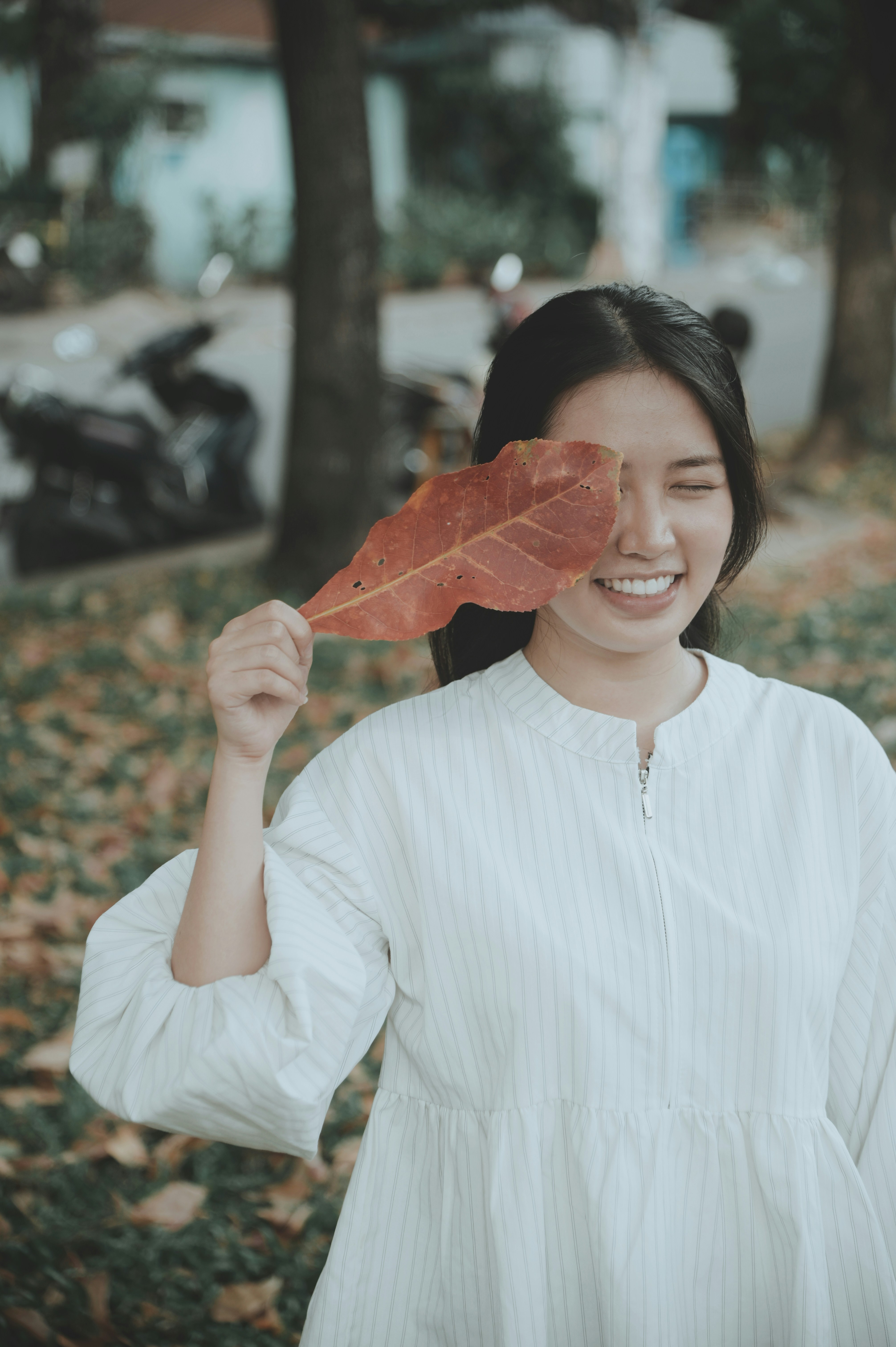 Leaf Over Eye, Smile Forward: A Quiet Autumn Moment