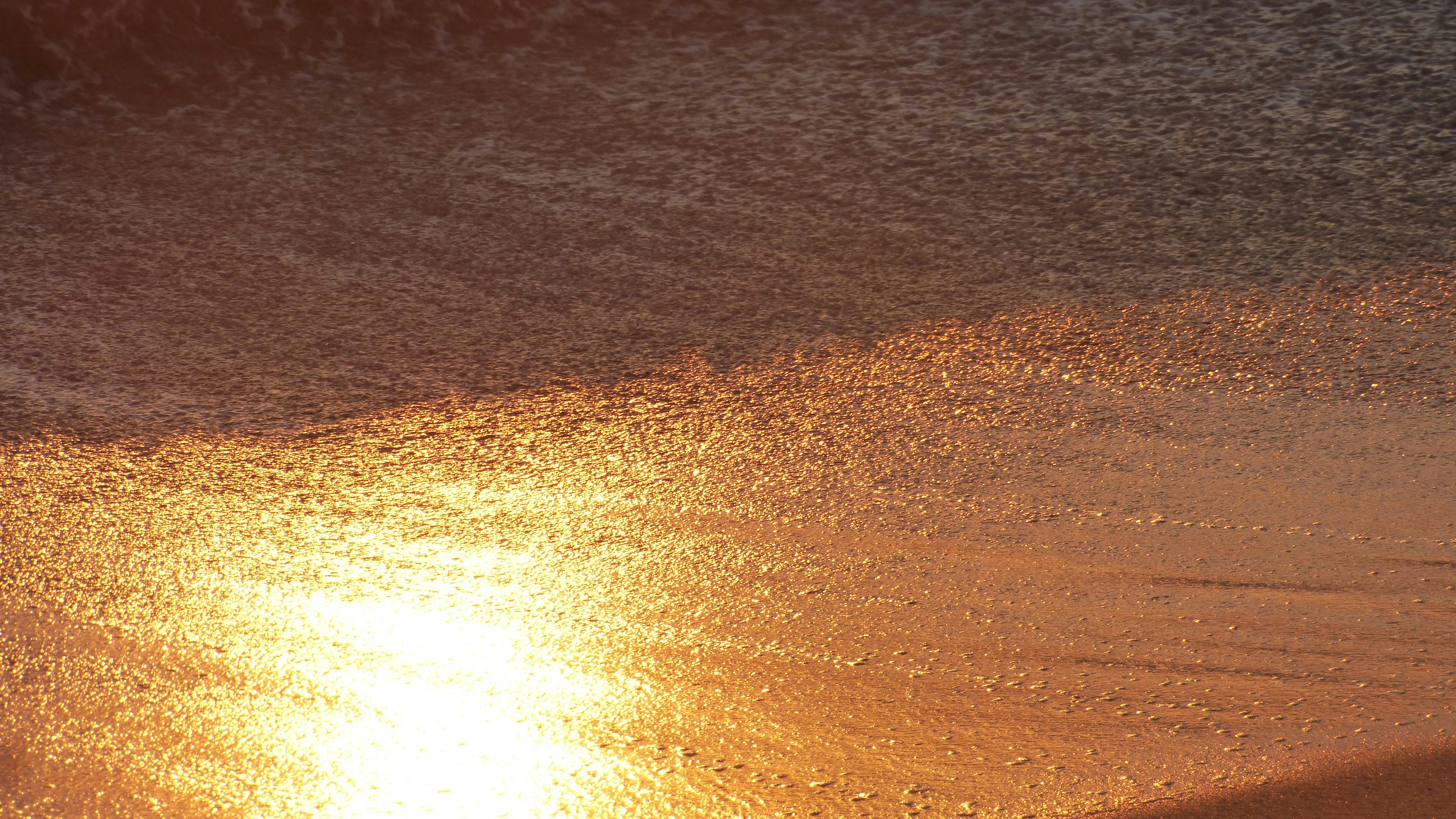 Gilded Tides: Sunset over a Quiet Shore