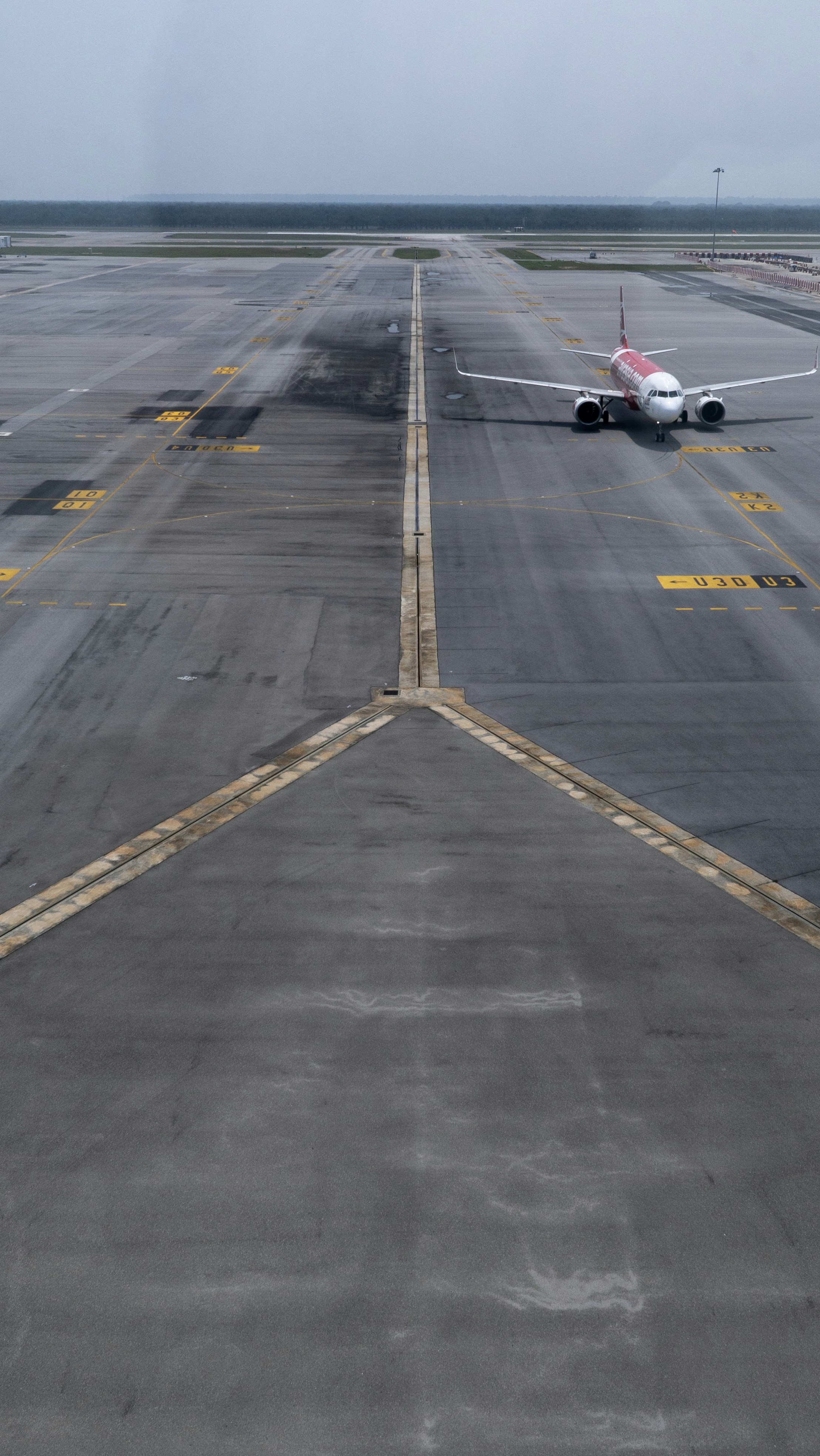 Taxiway Convergence: A lone aircraft at the Terminal Gate