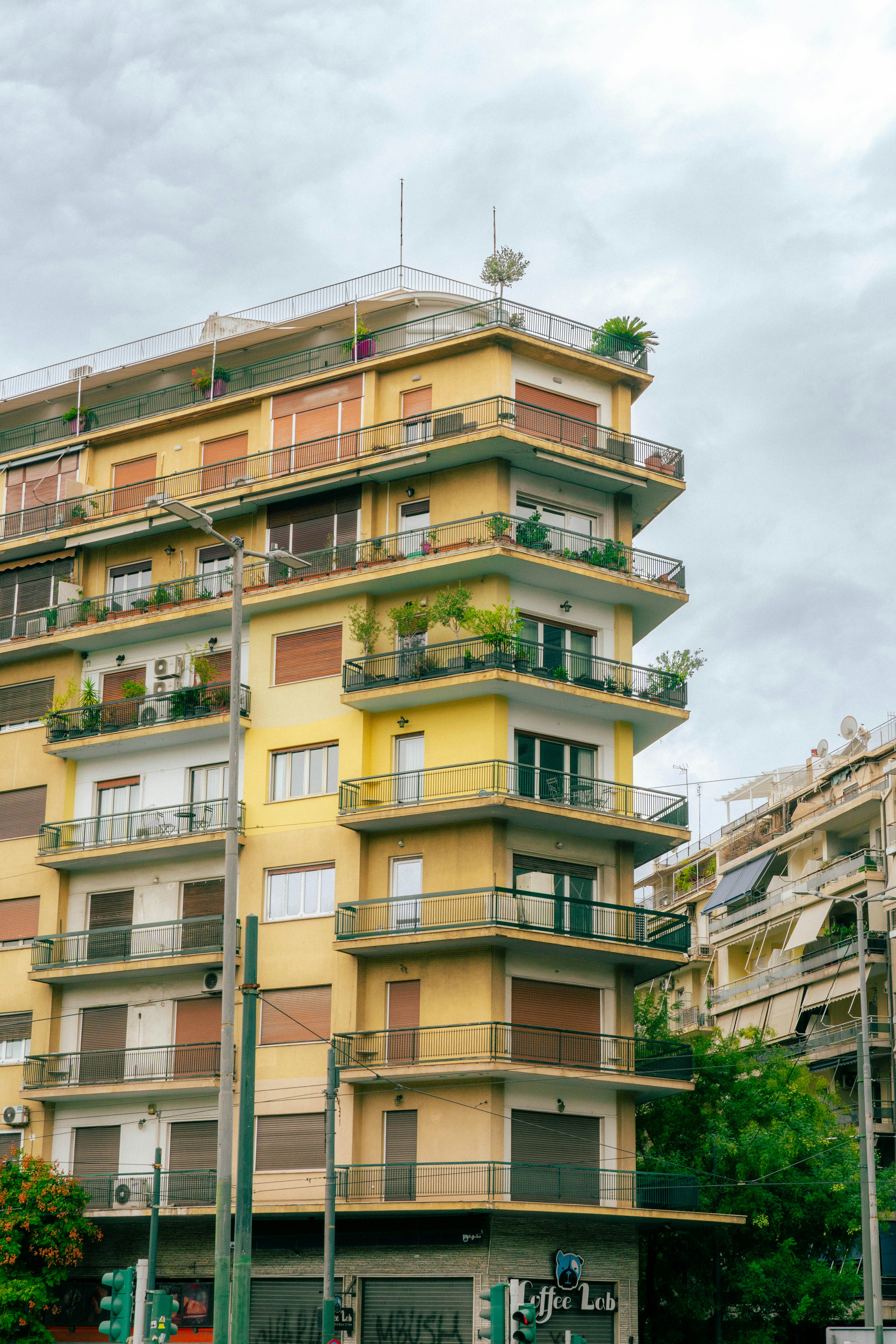 Sunlit Yellow Terrace: A Leaning Urban Panorama