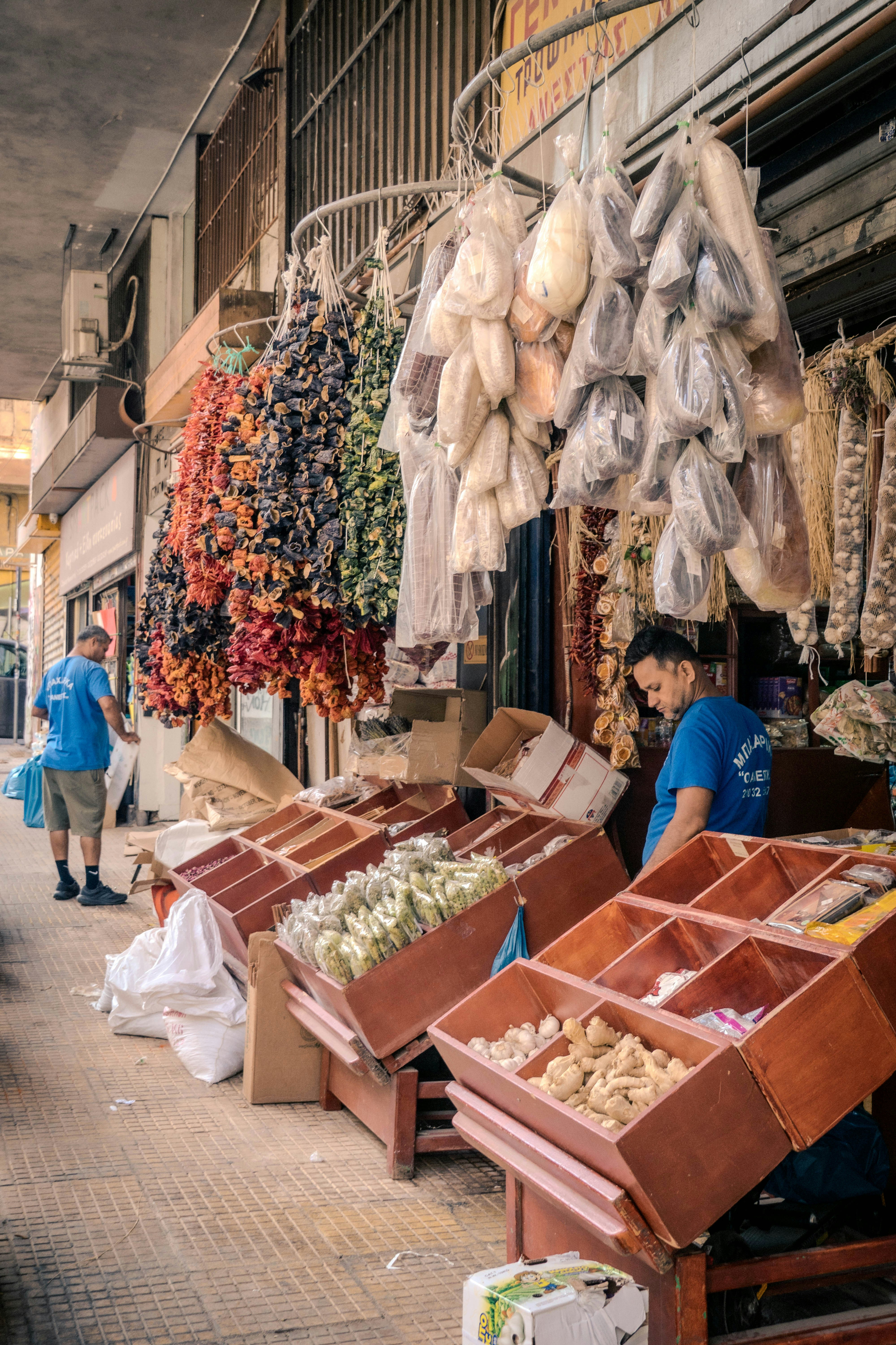 Market Stalls Cloaked in Color: Garlic, Peppers and Ginger in a Bustling Alley