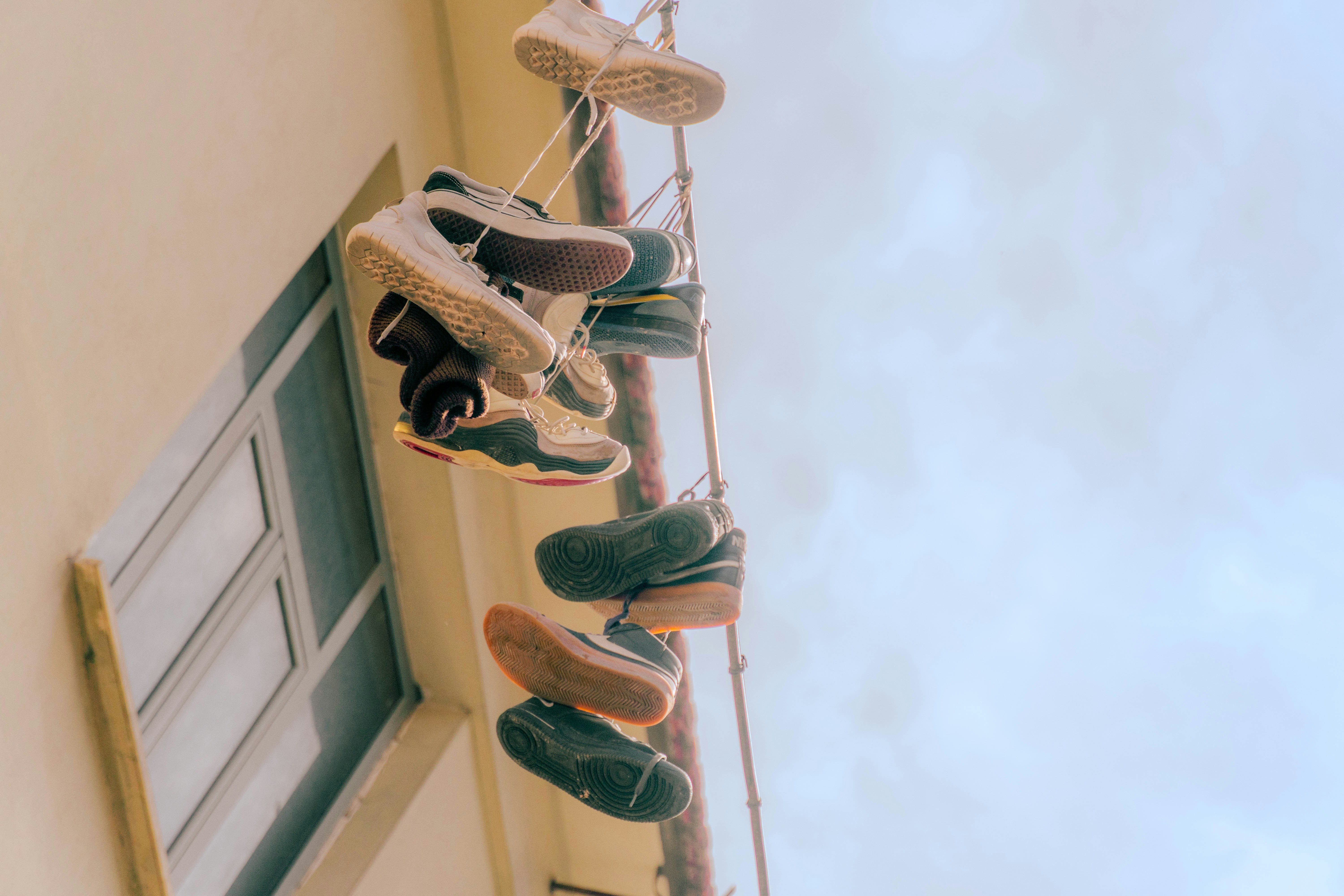 Shoes in the Sky: A Climb of Colorful Kicks on a Rope