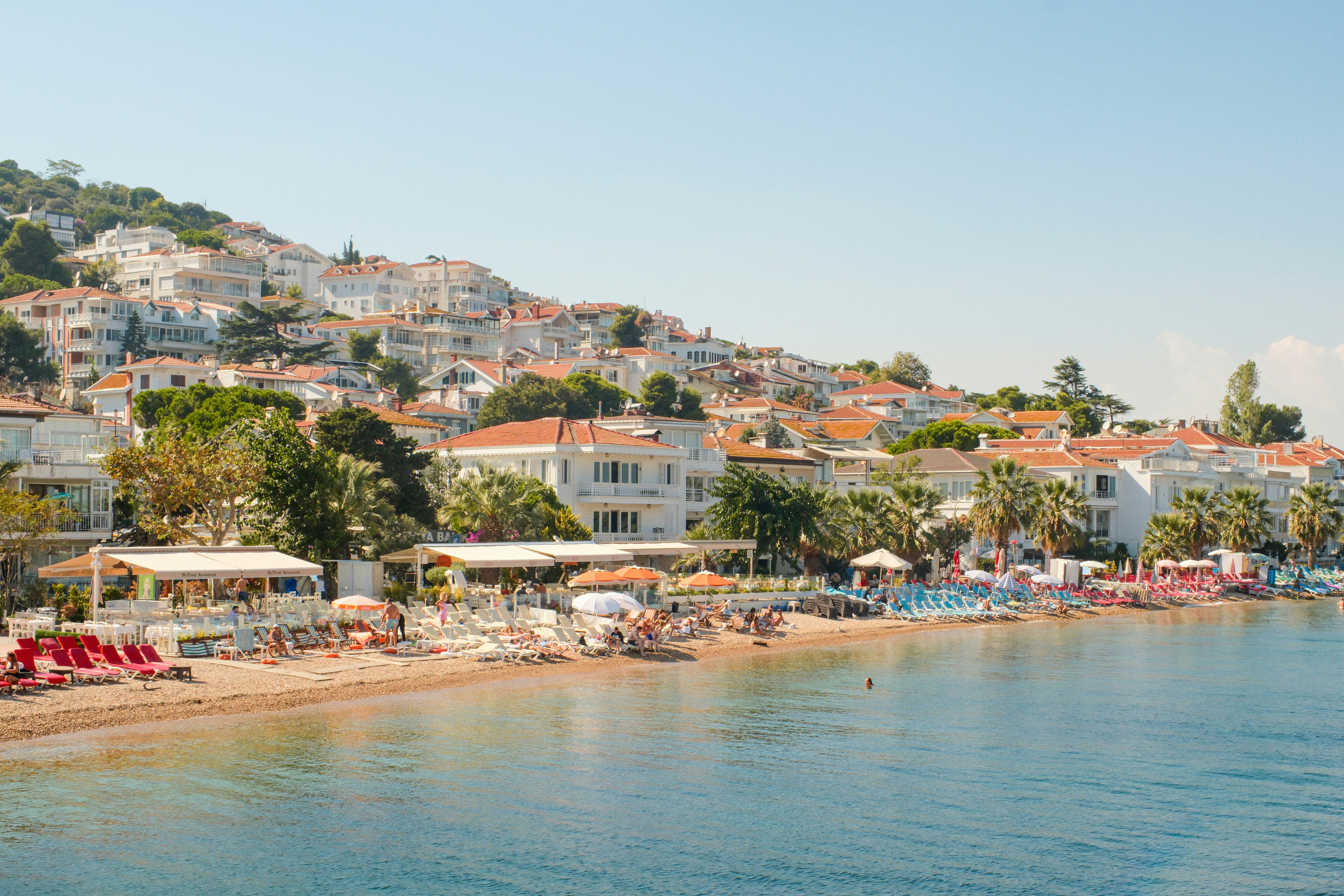 Sea-facing Village: Sunlit Beachfront with Terraced Homes