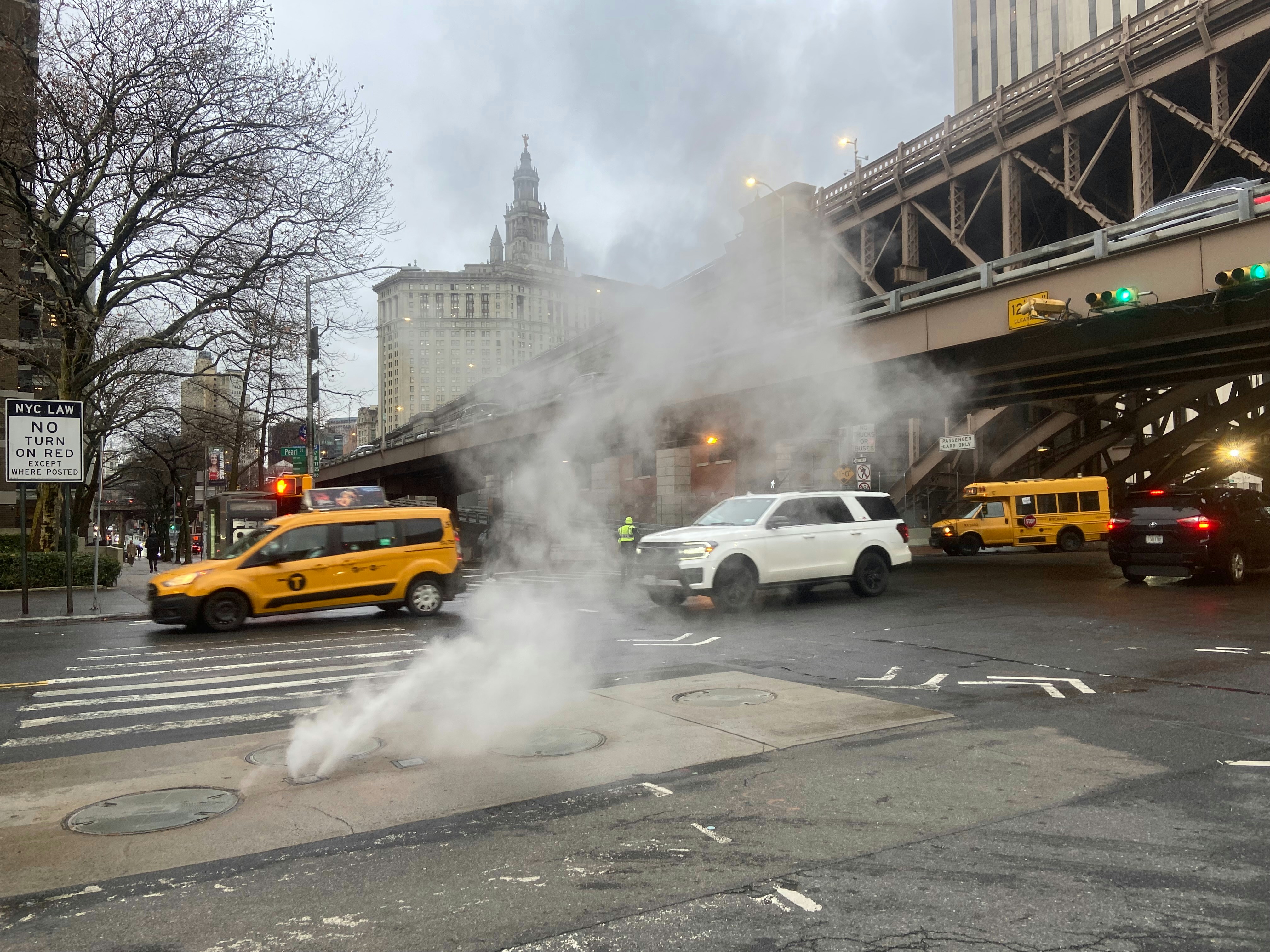 Steam Cloud and Street Ballet at a City Intersection