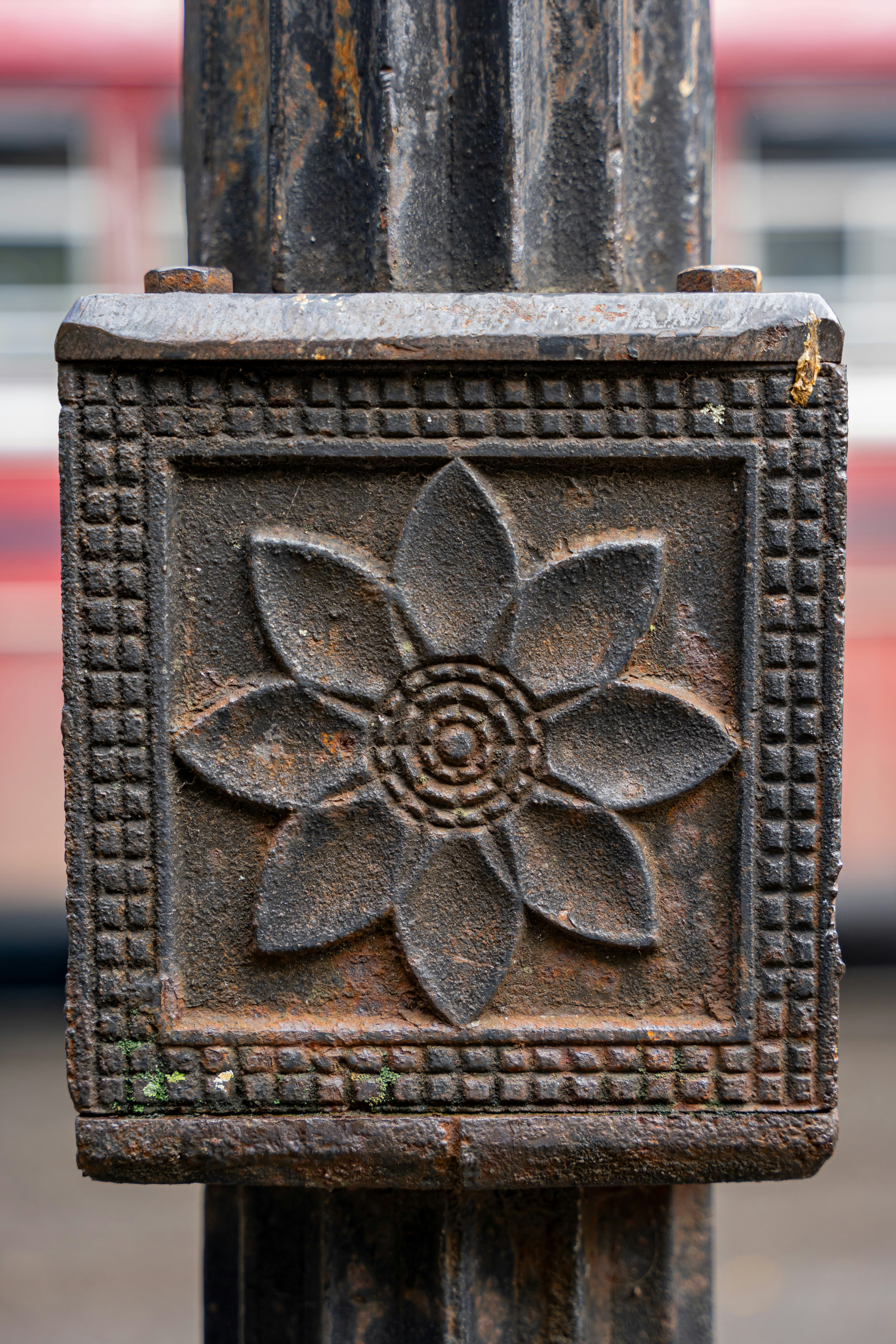 Rustic Flower Emblem on a Weathered Street Post