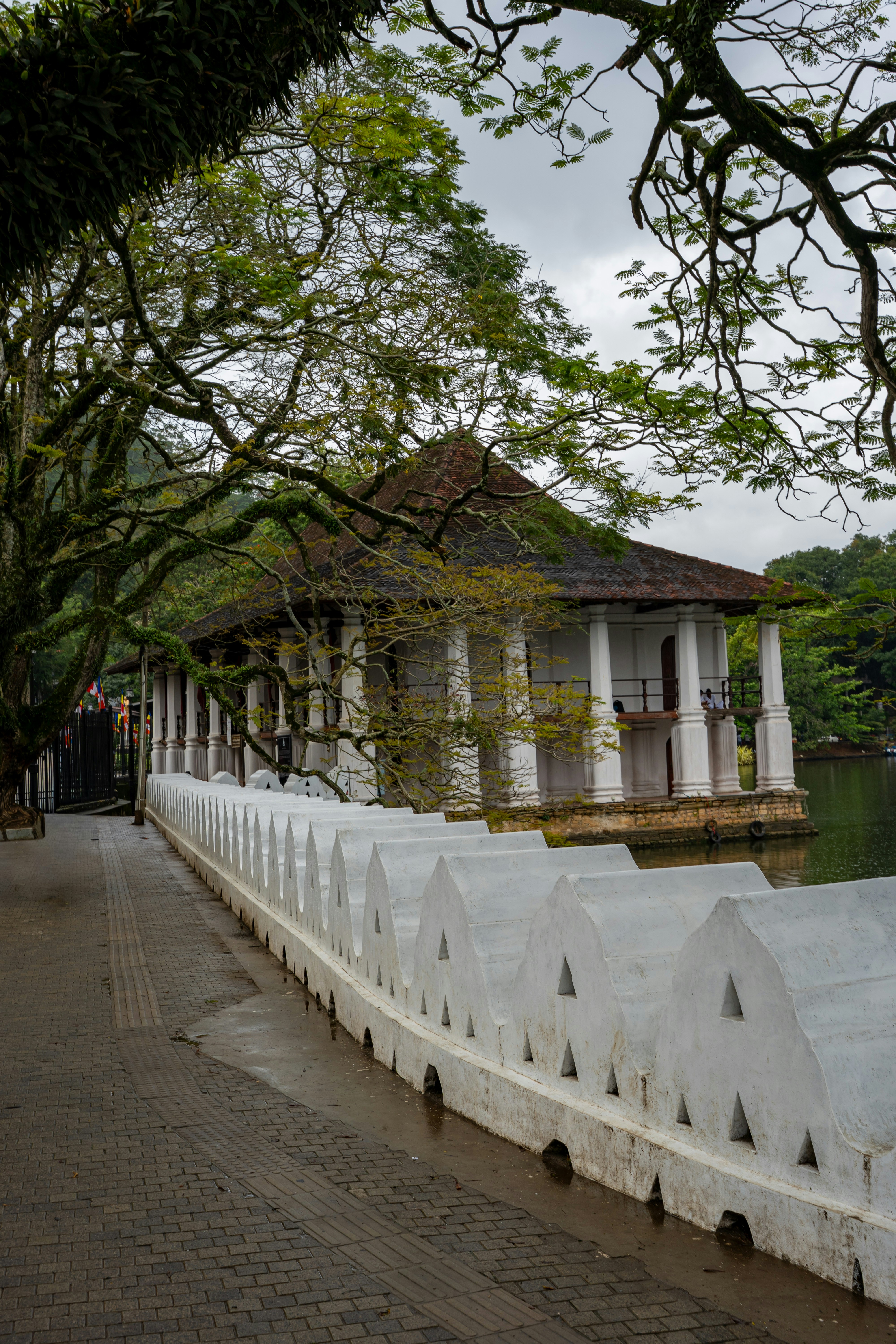 White-walled bridge and pavilion over tranquil water