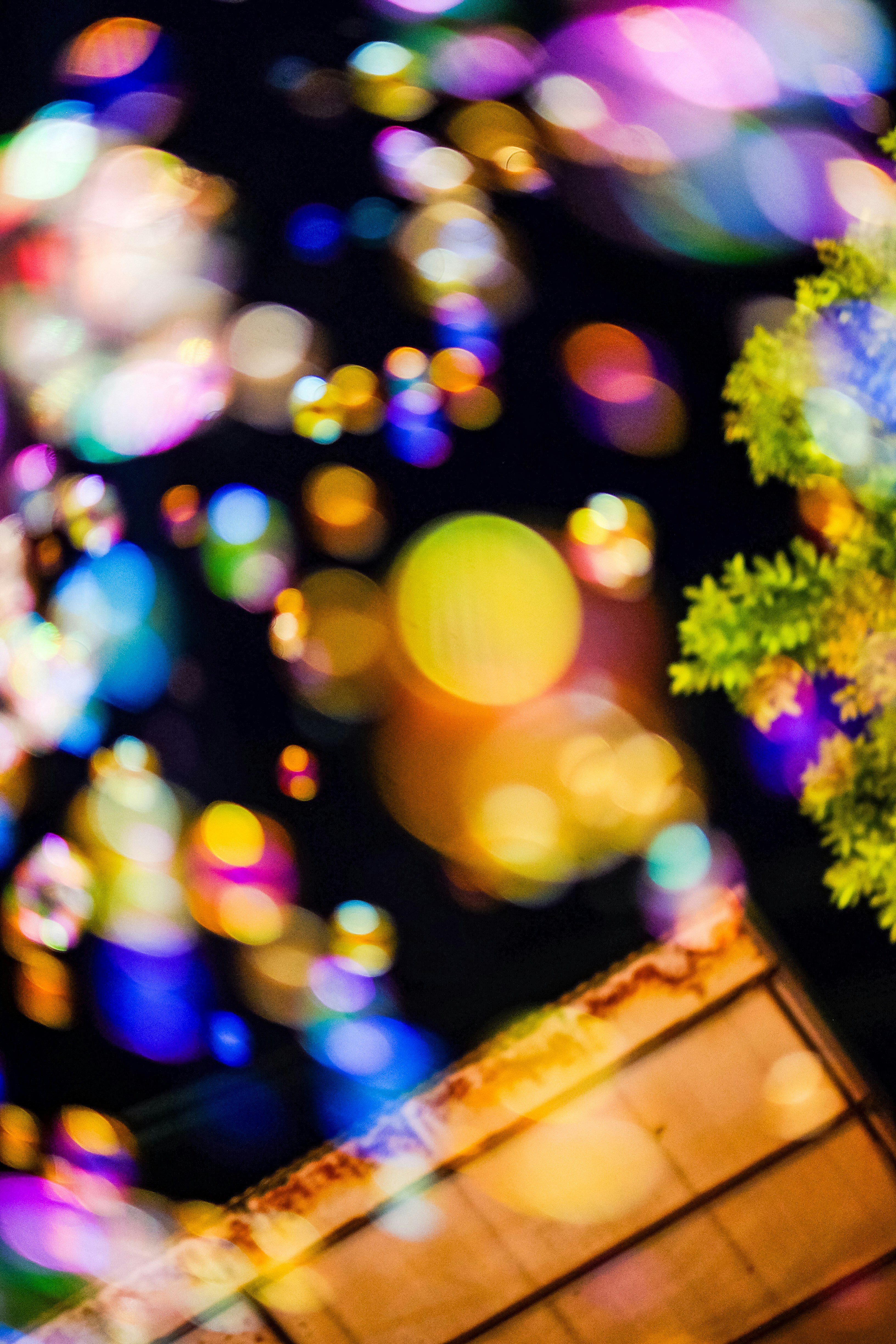 Bokeh Night: Neon Orbs Dancing Across a Dim Urban Edge