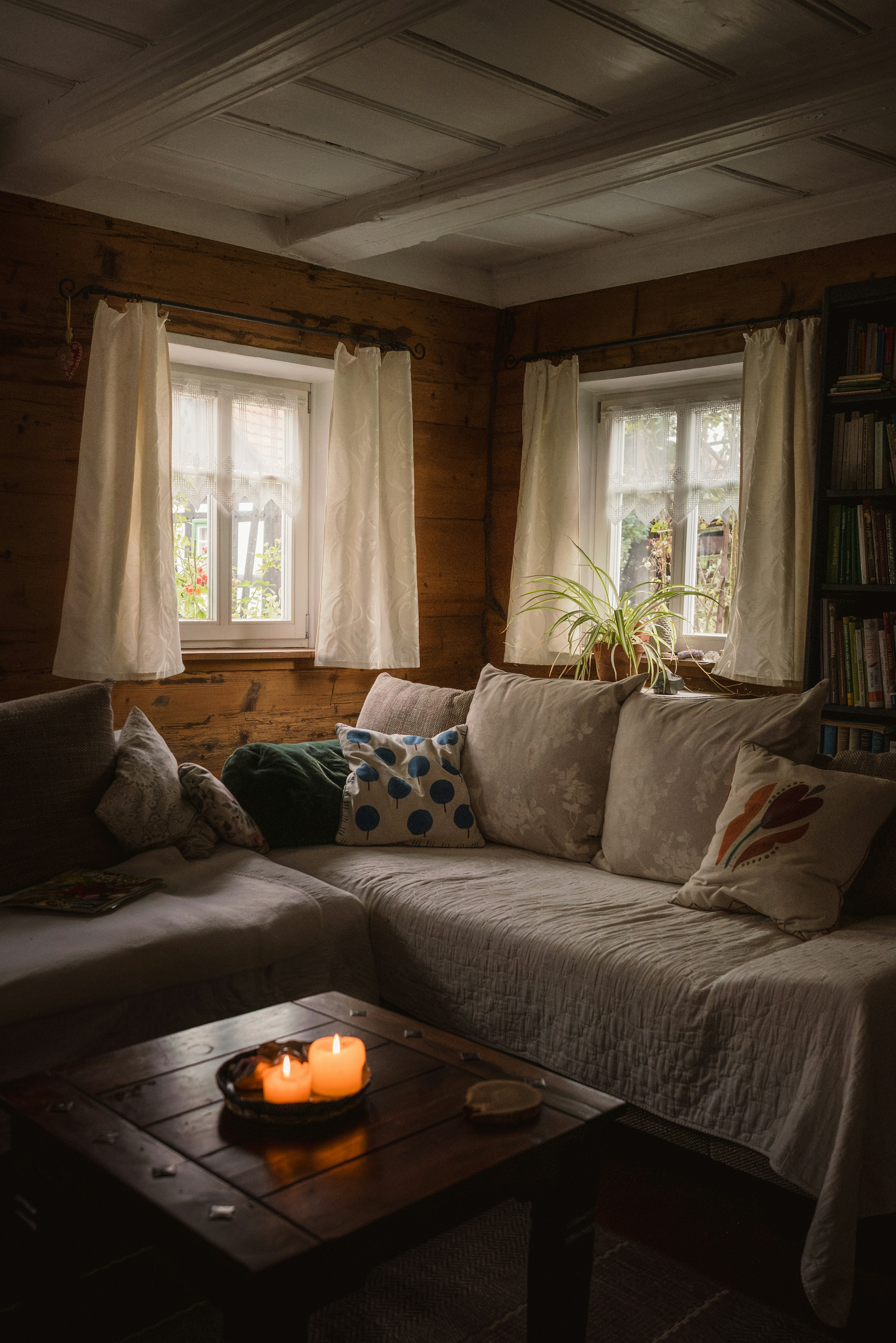 Warm Corner: Candlelit Cozy in a Wood-Panel Living Room