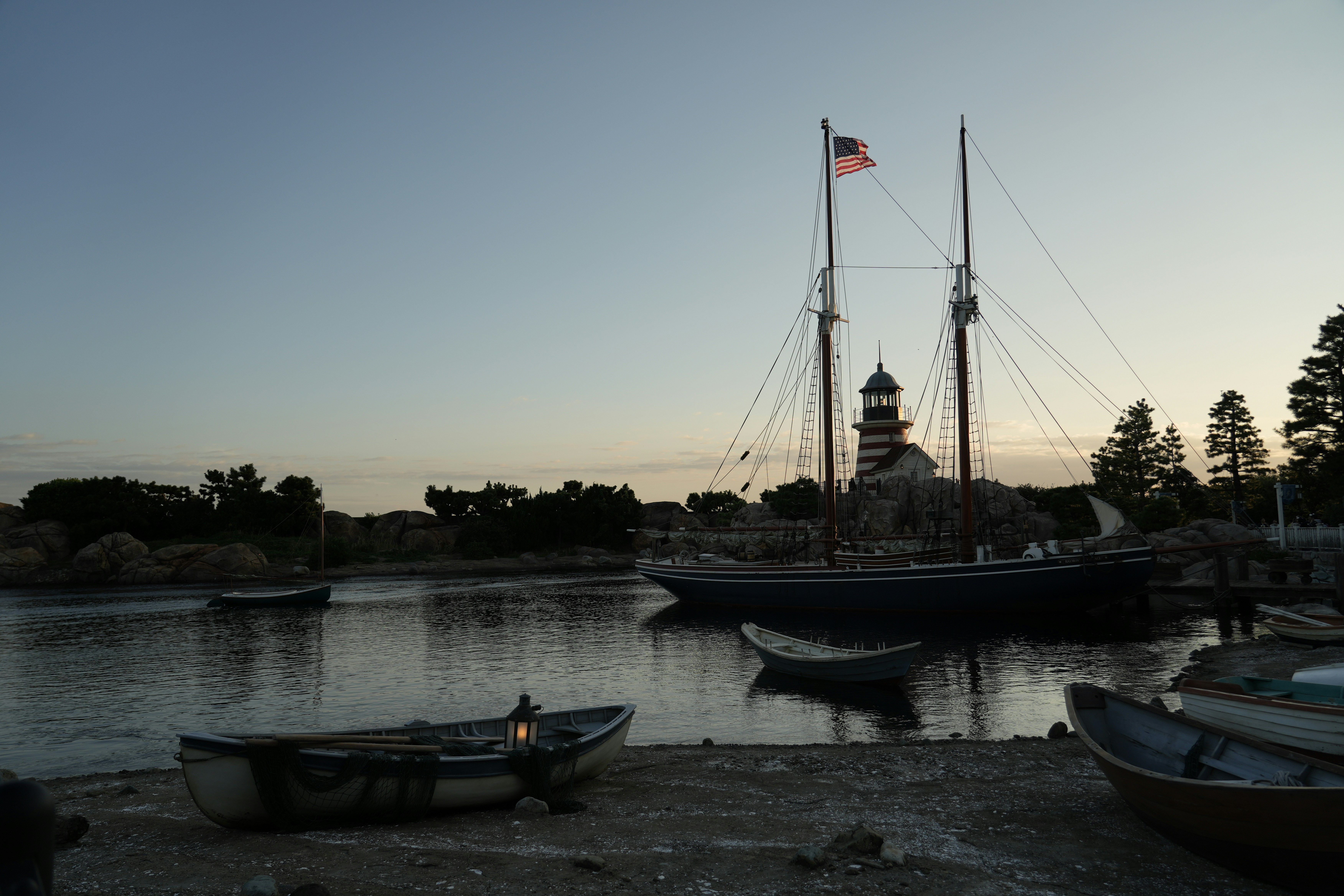Sail and Anchorage at Dusk: A Tranquil Harbor Portrait