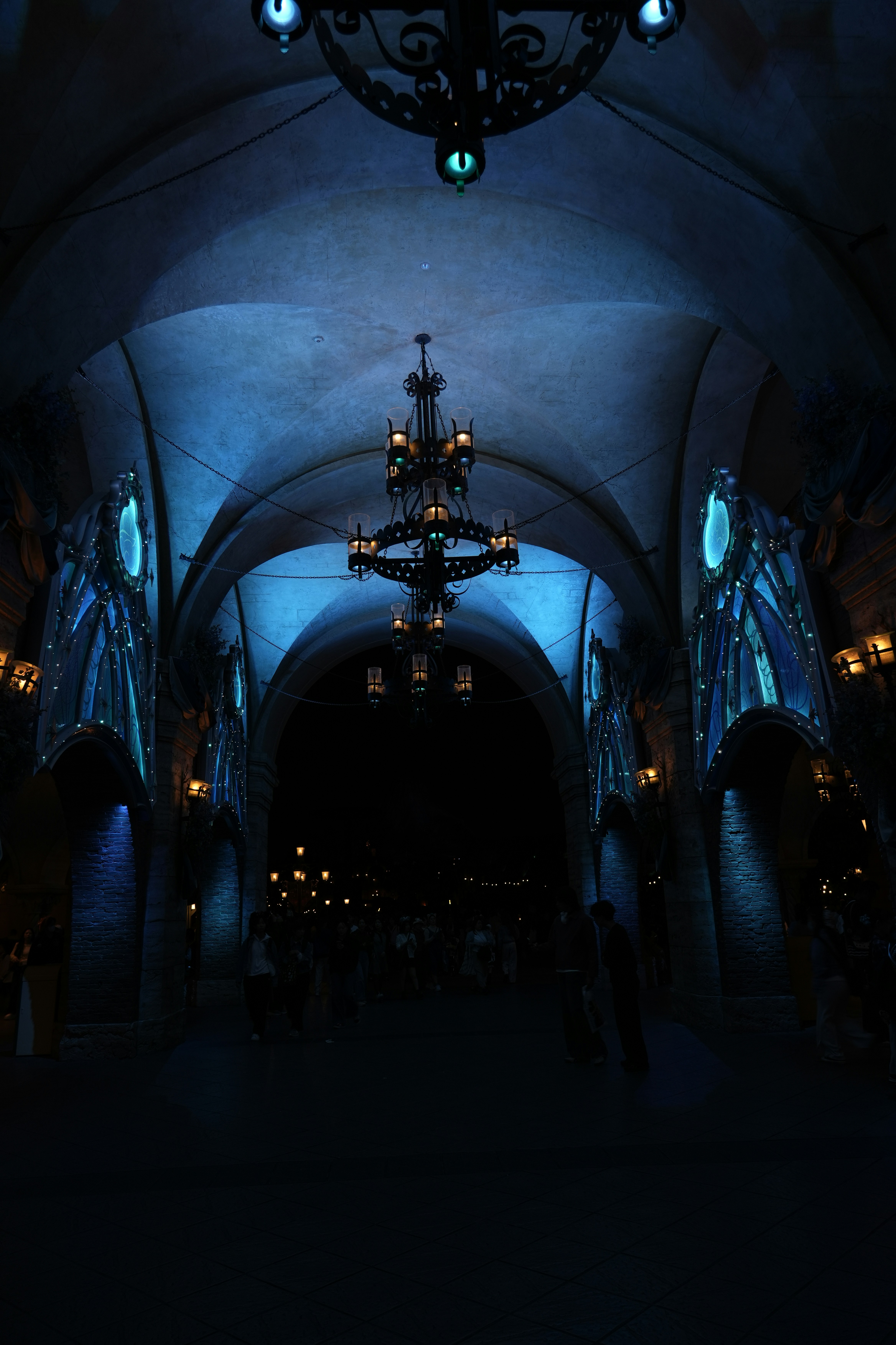 Blue Cathedral Arches: Night-lit Corridor of Circles and Lanterns