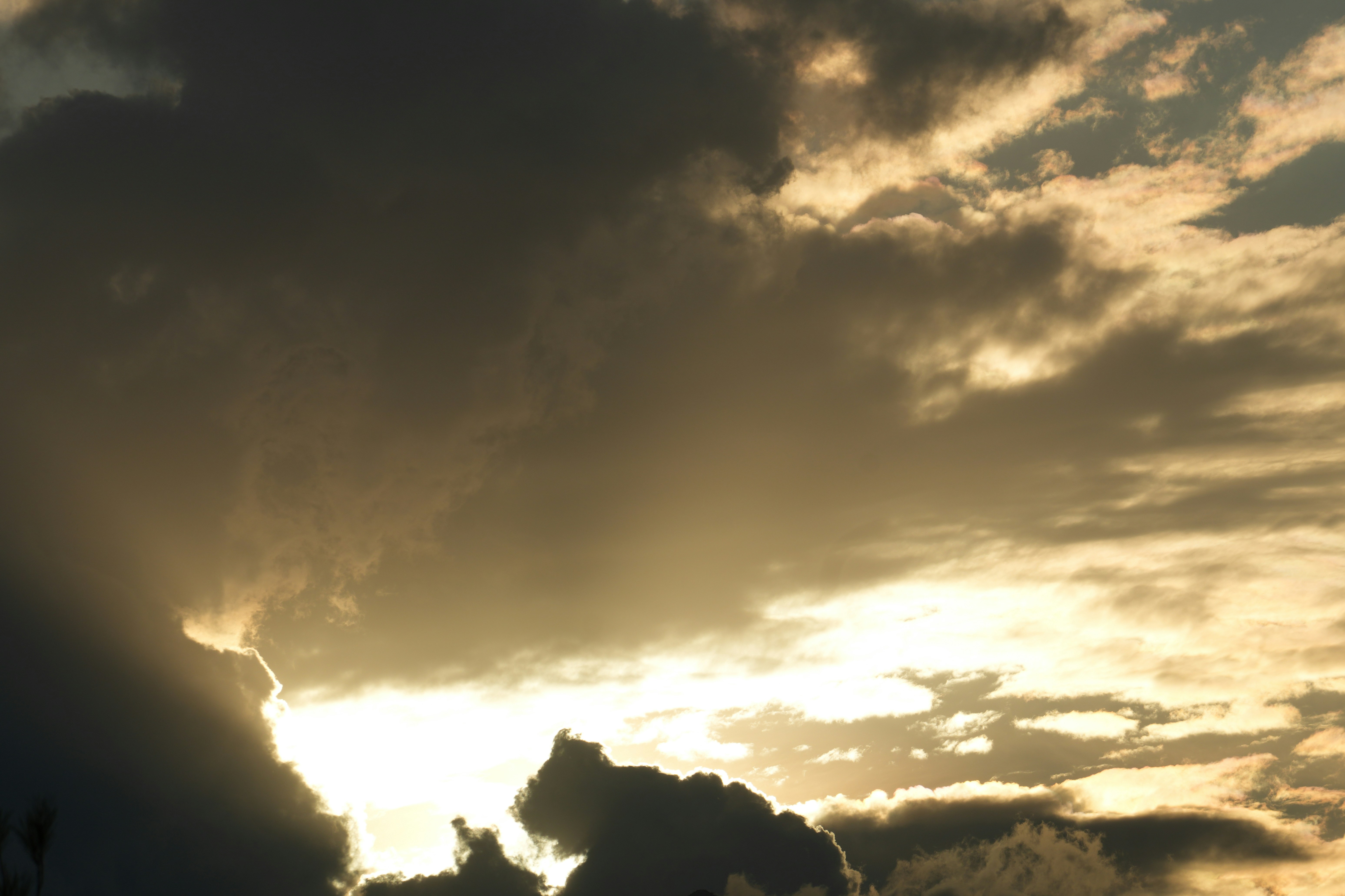 Dawn Collision: Sunlit Break through Distant Clouds