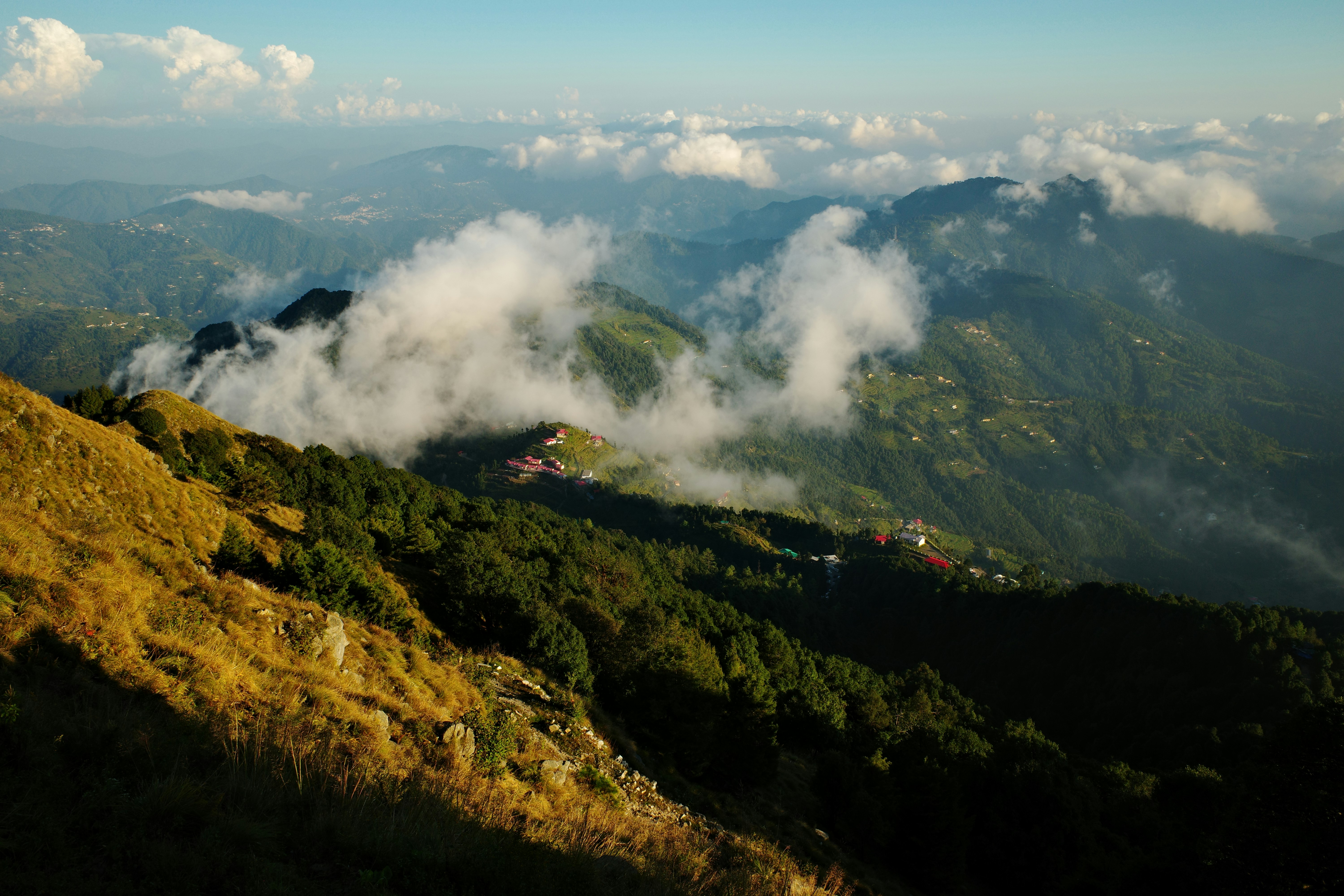 Cloud-kissed Ridge: A Panoramic Mountain Crest at Daybreak