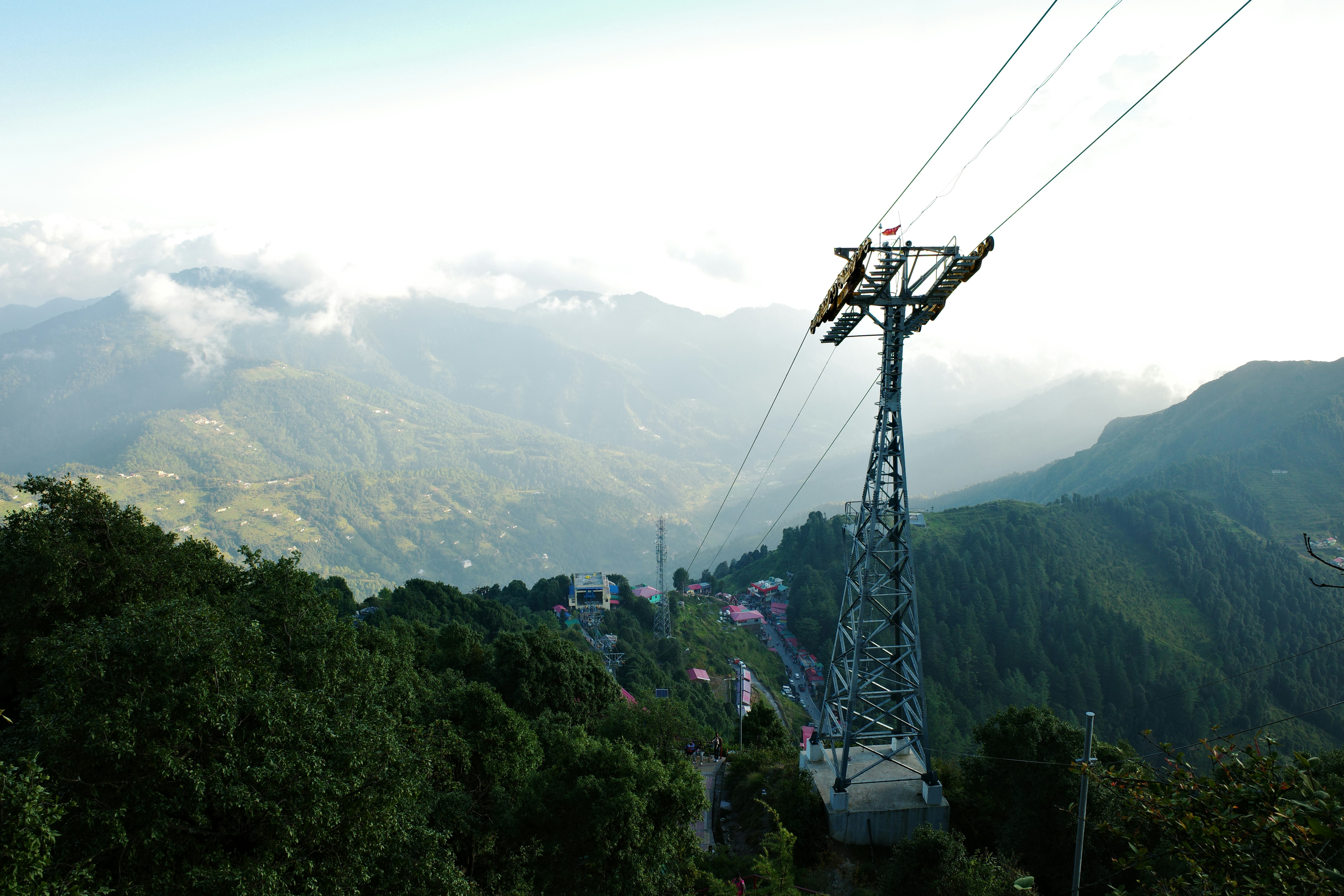Cable Car Overlook: Mountain Town Under Rising Mist