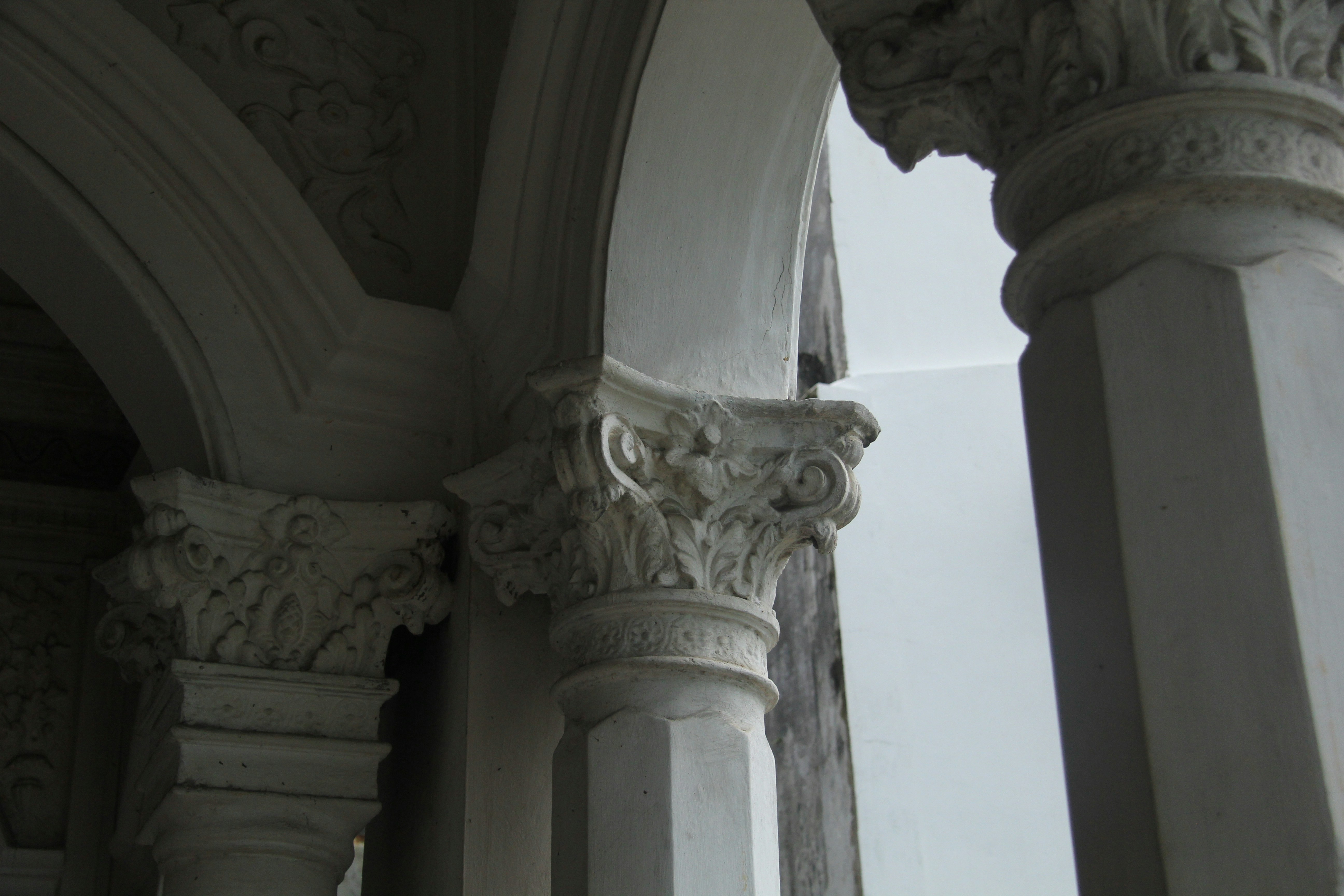 Stone Carved Arches and Pillars in Dim Light
