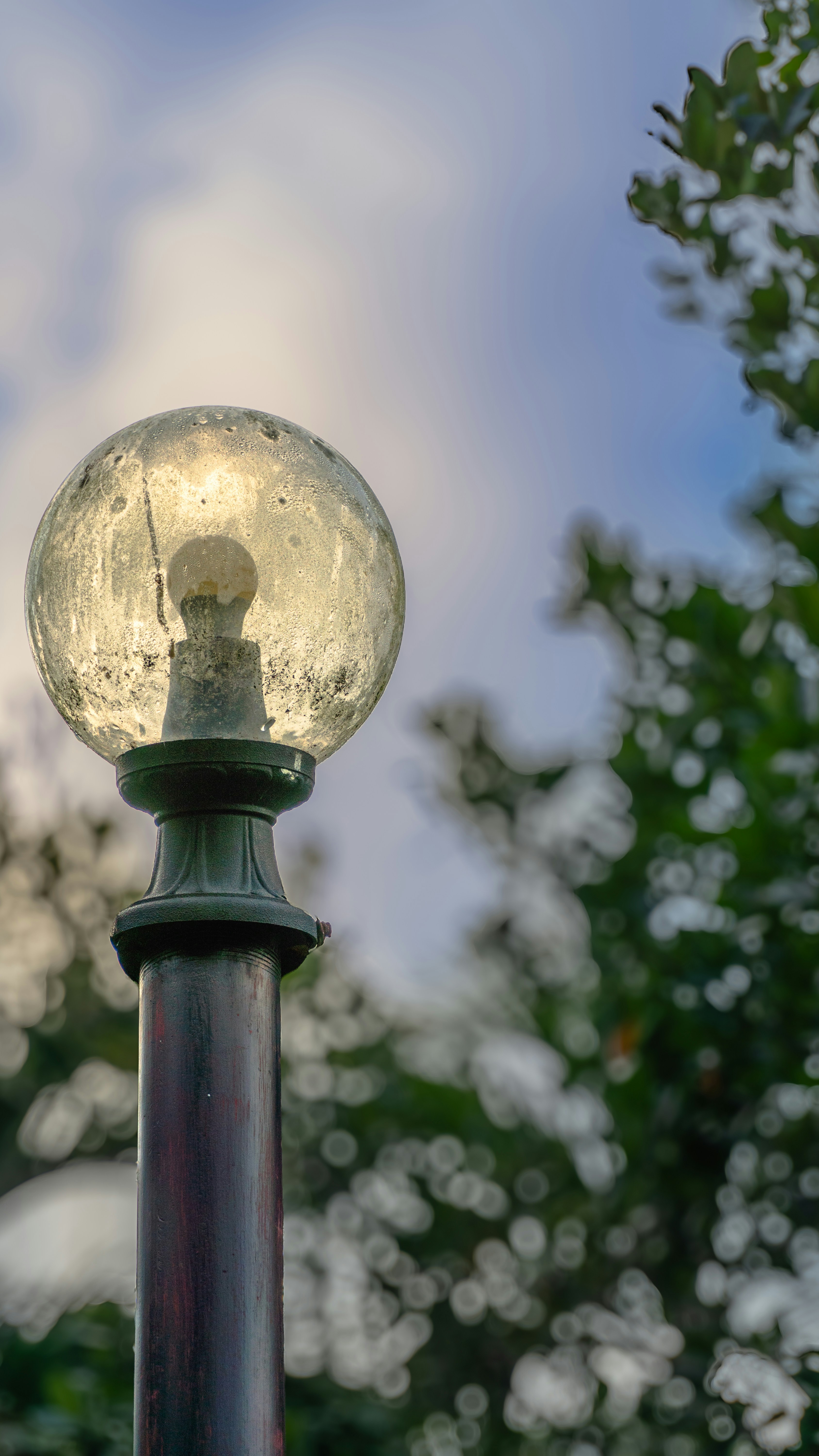Glowing Globe: A Lantern's Quiet Vibe Against a Sky
