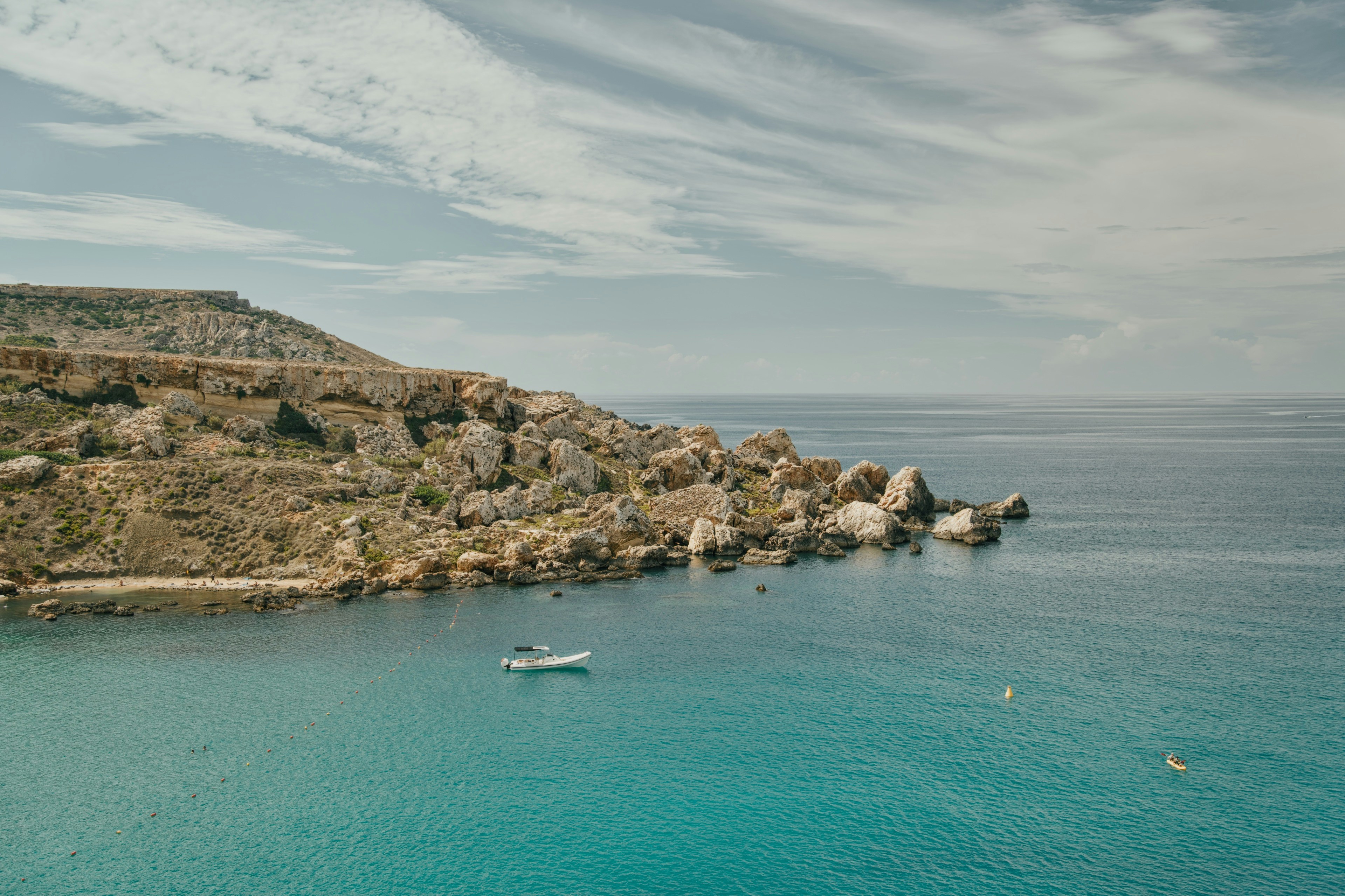 Turquoise Cove Beneath a Cliffed Horizon