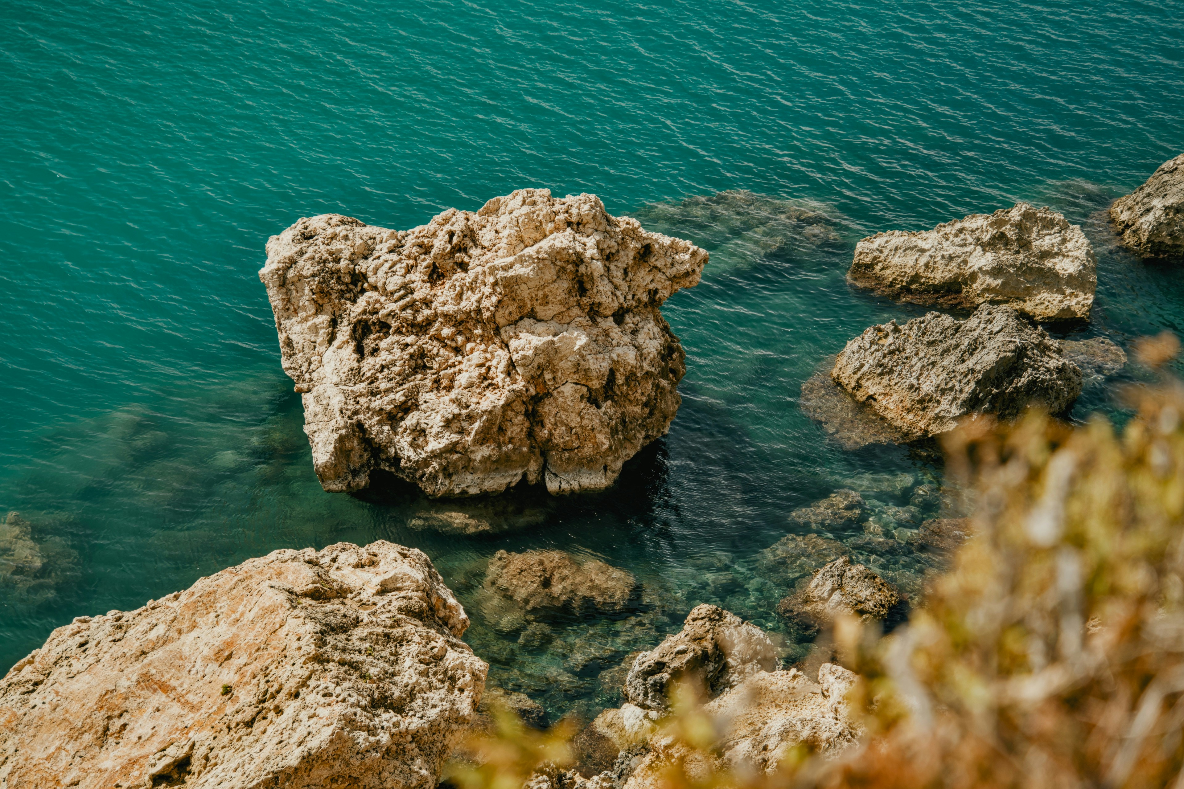 Sea-stone Sentinel: A Quiet Cove Among Rugged Limestone