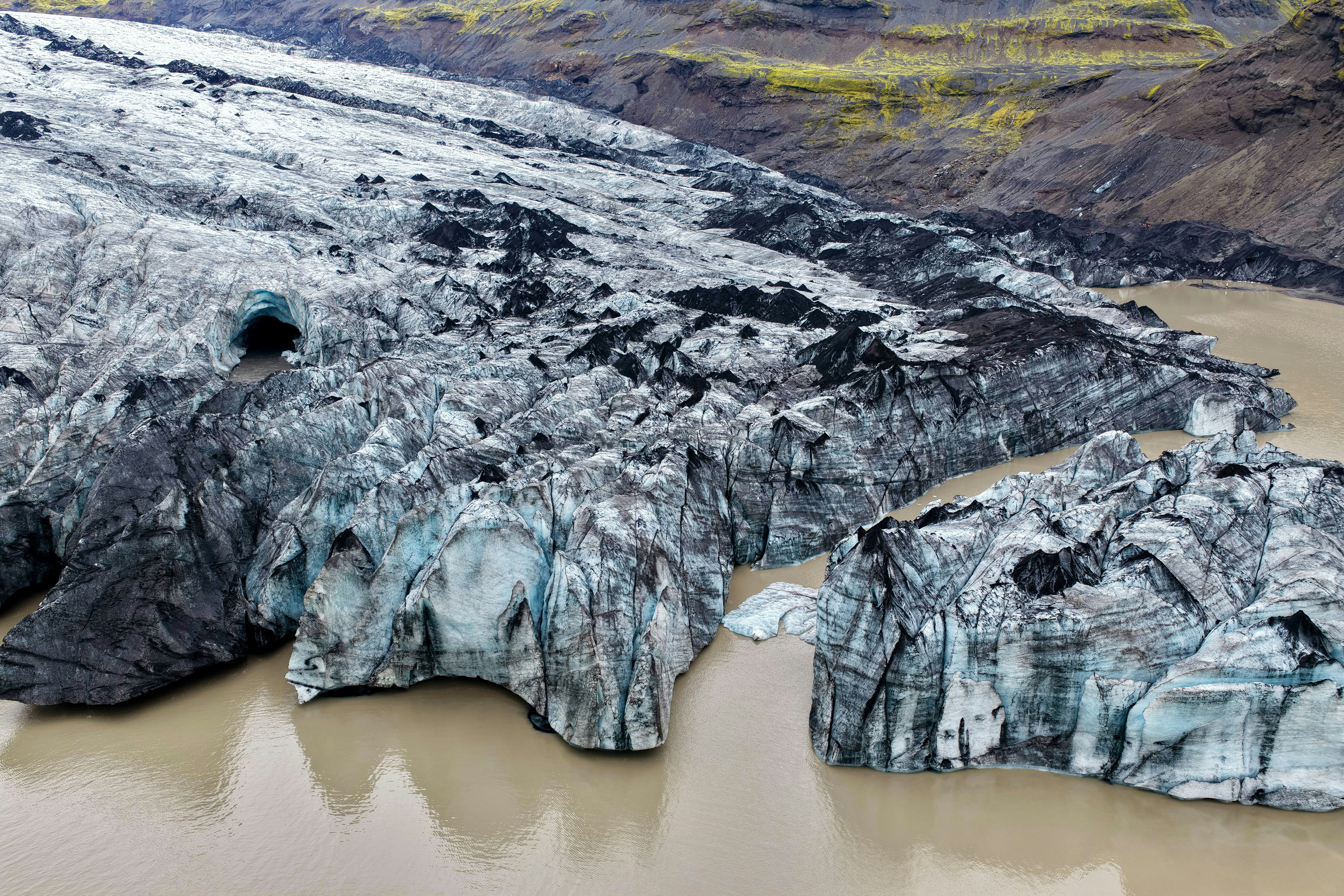 Glacial Ridges and Meltwater: A Quiet Front on a Snowy Fjord