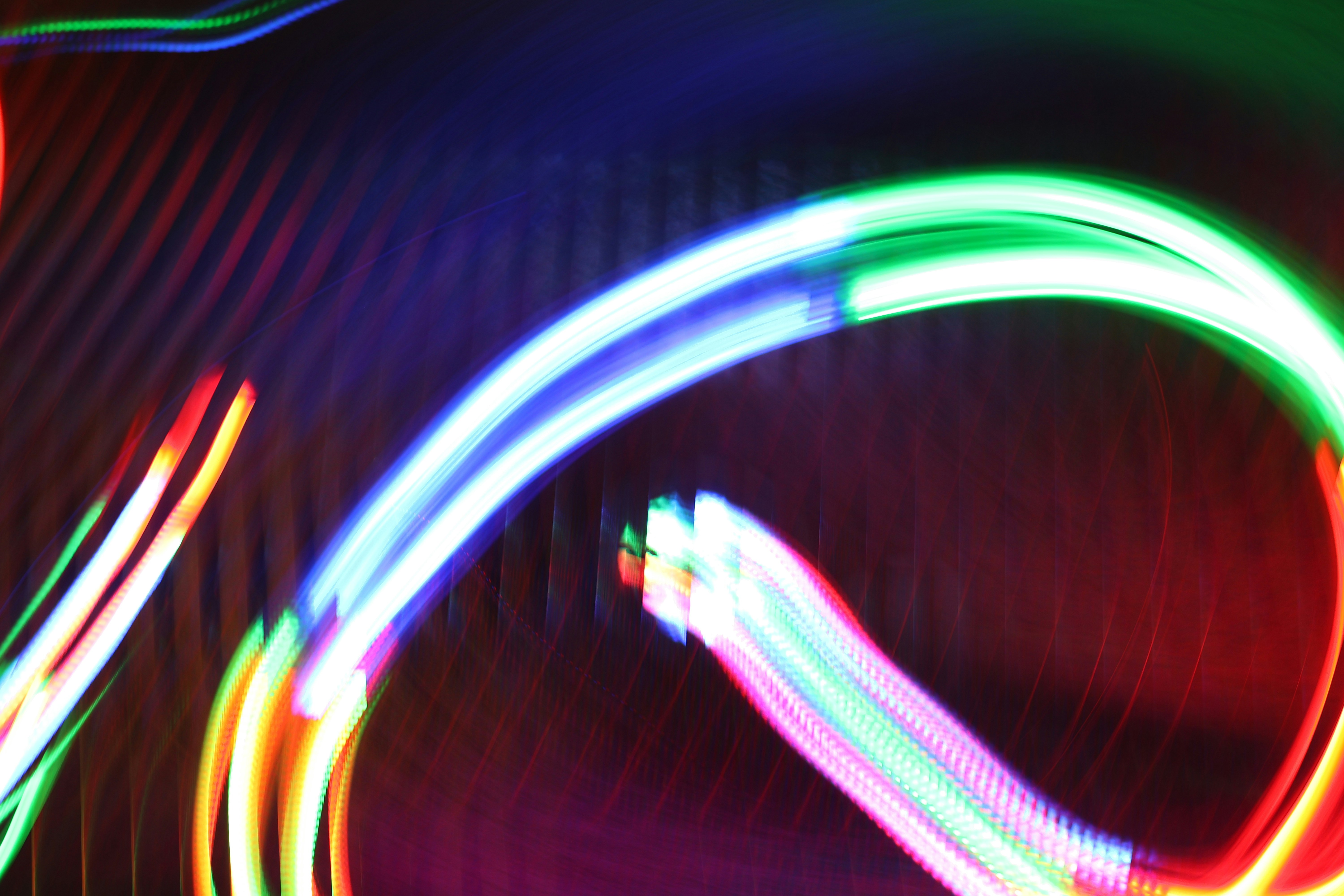 Neon Momentum: Whirl of Light Trails