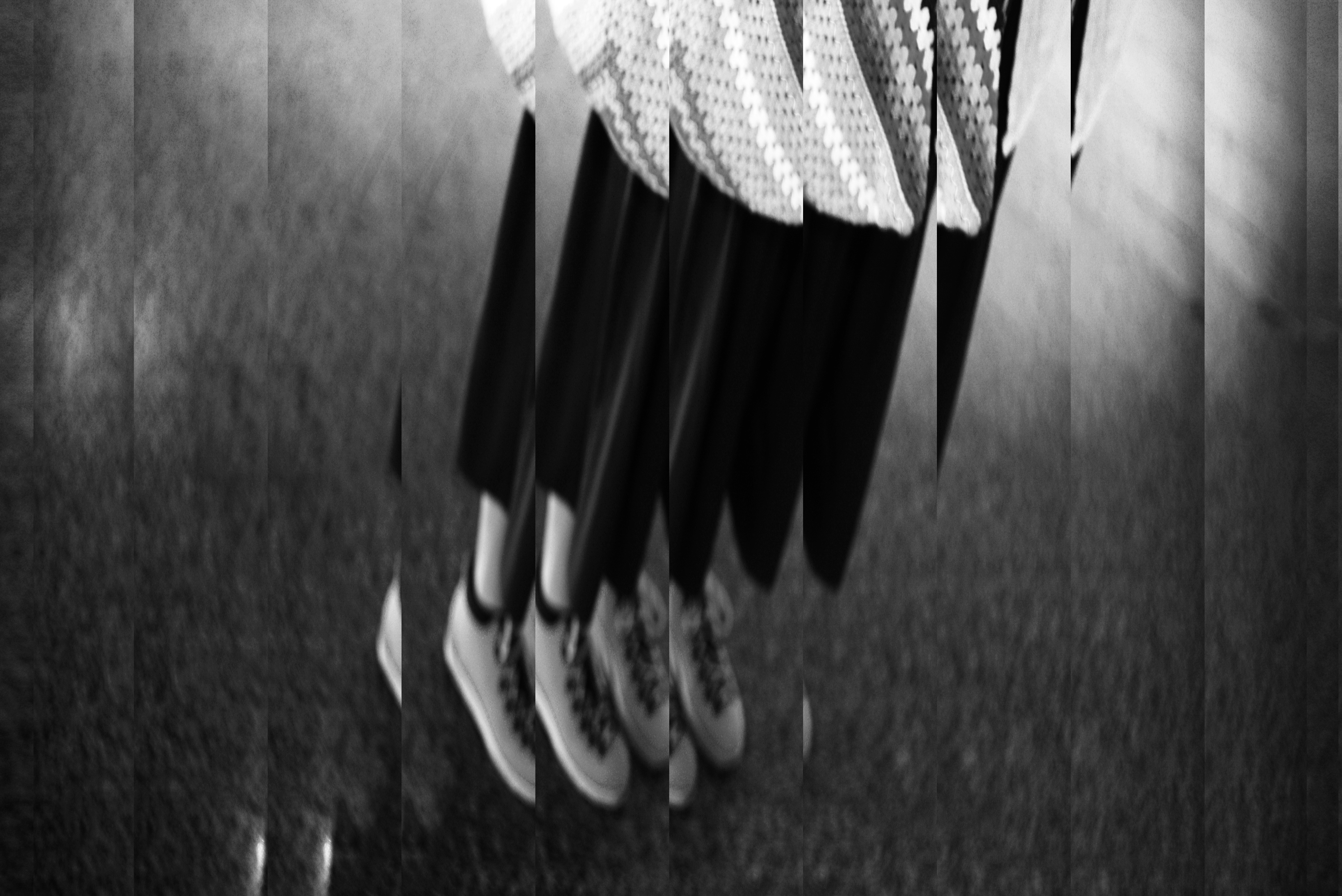 Tilted Choir of Shoes: A Kinetic Black-and-White Portrait