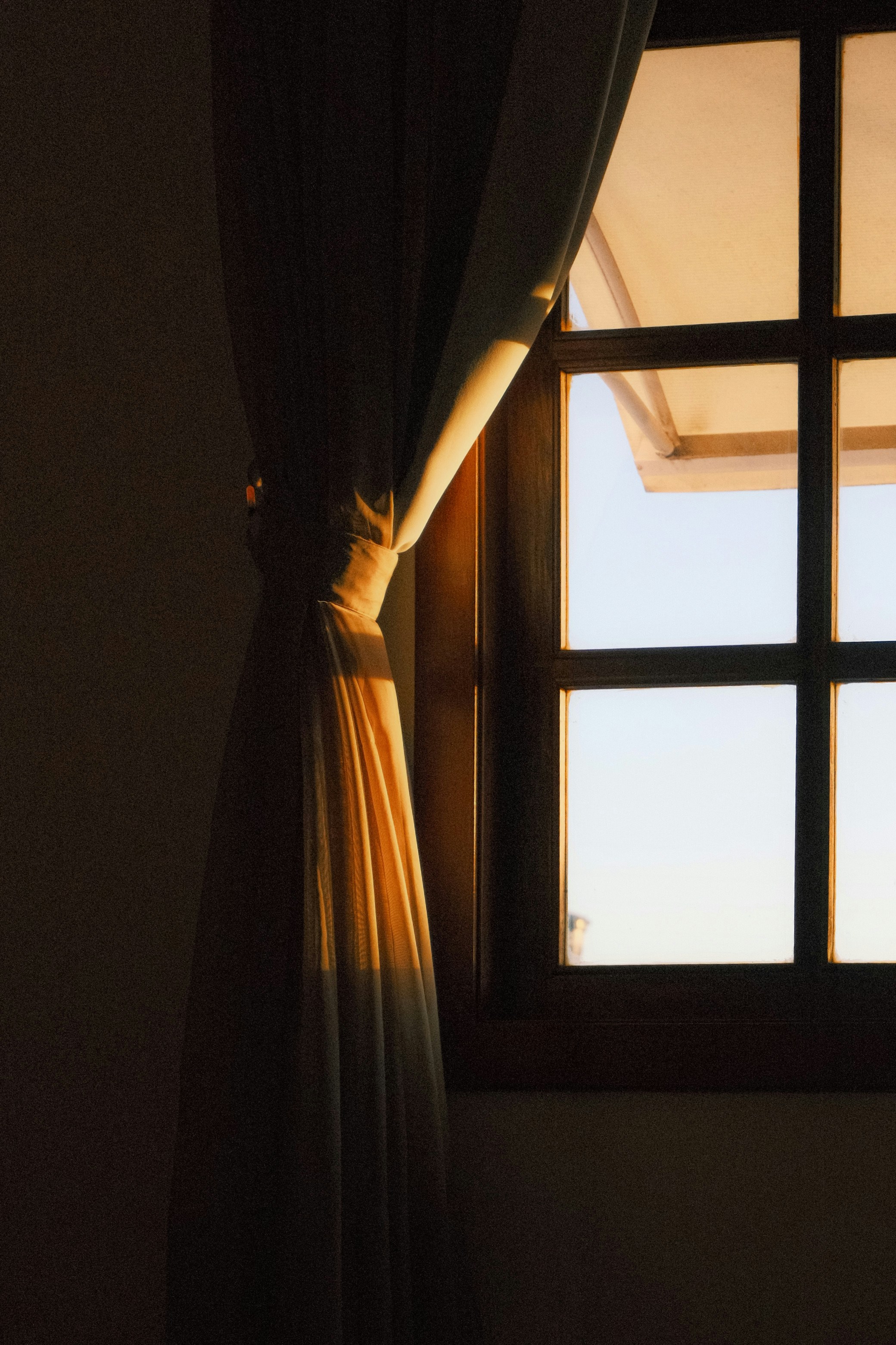 Sunlit Grid: Curtains Framing a Quiet Window