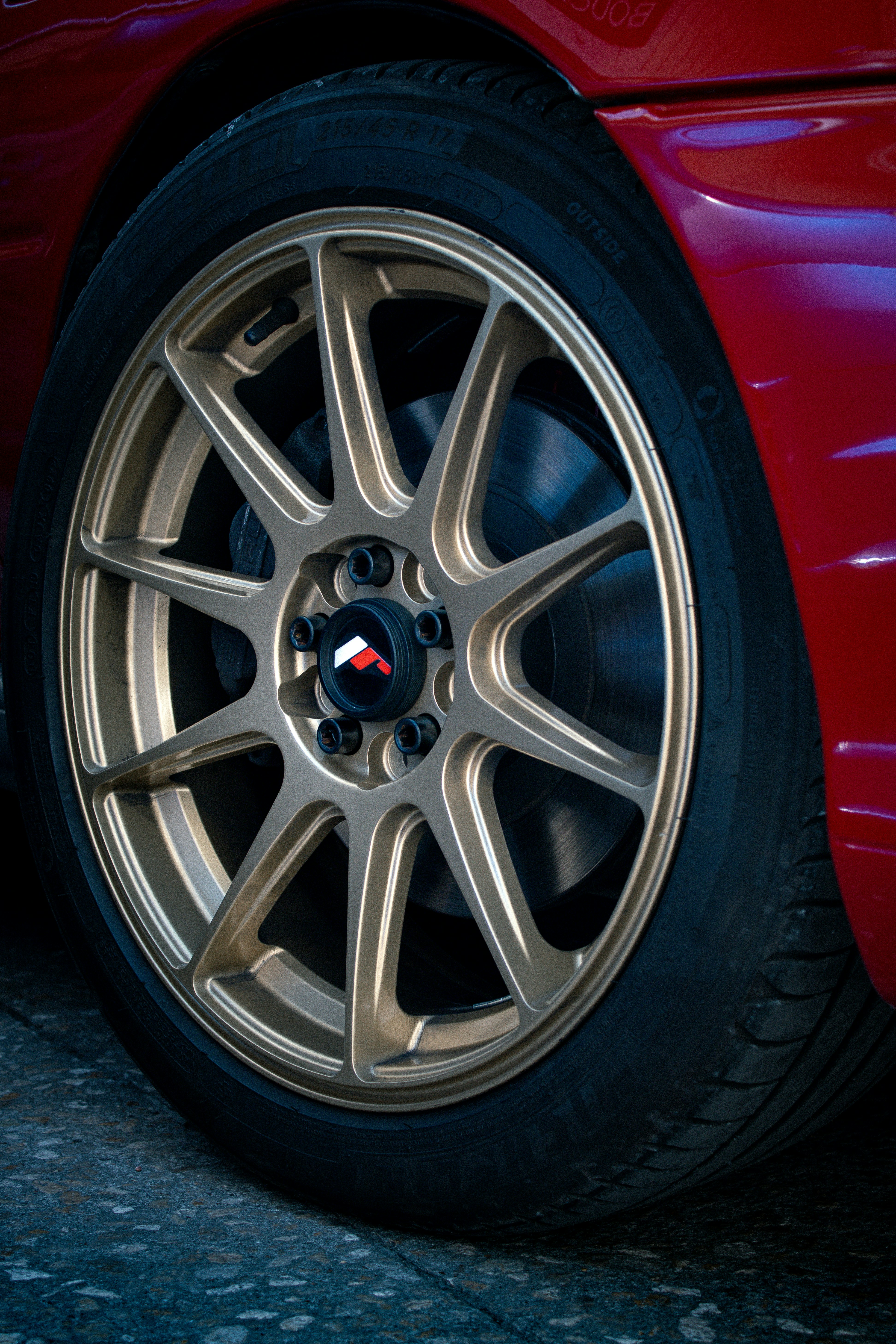 Golden Rim Velocity: A Car Wheel Close-Up