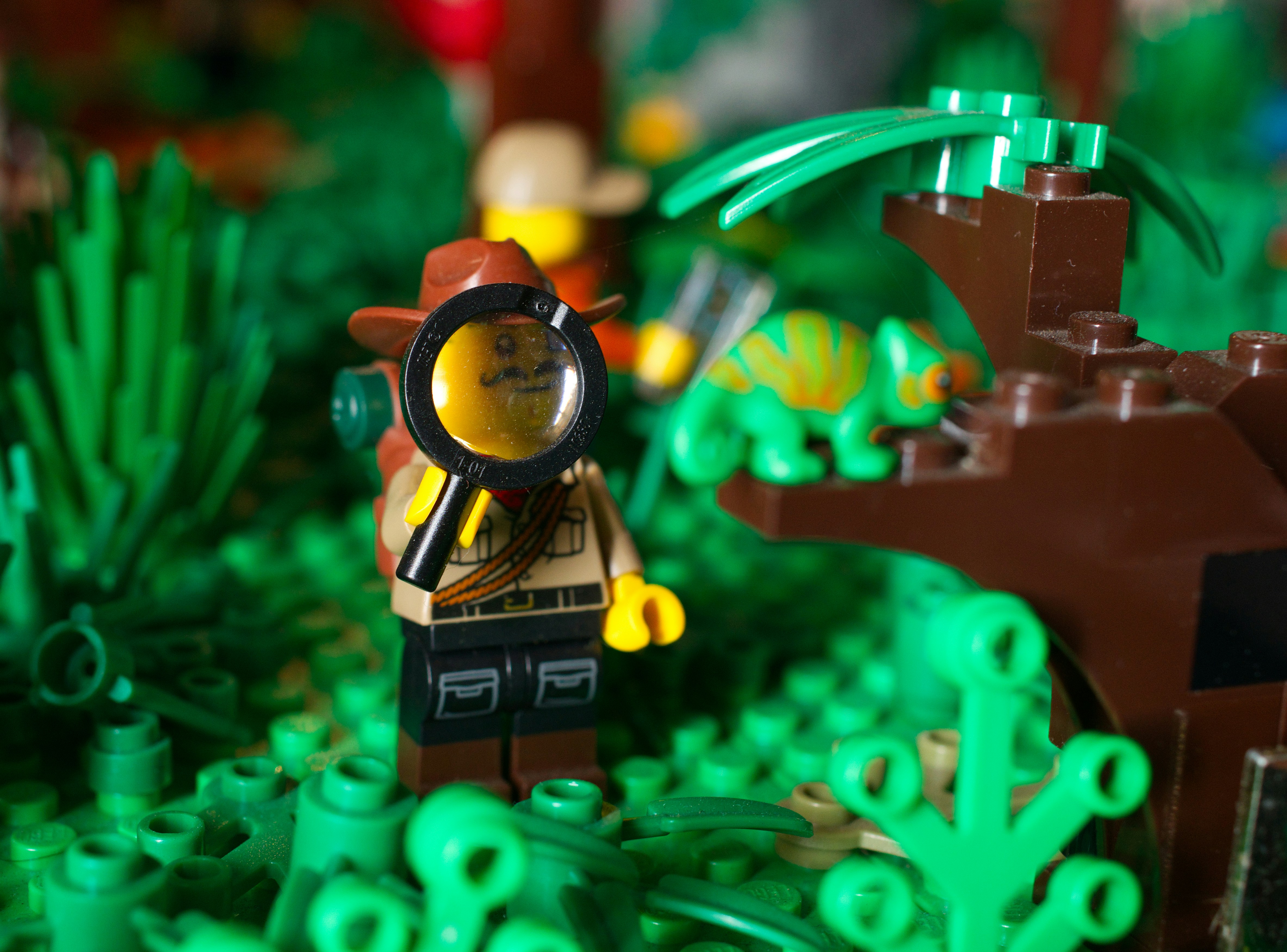 Magnifying Glass Adventure: Explorer LEGO in a Jungle Clearing