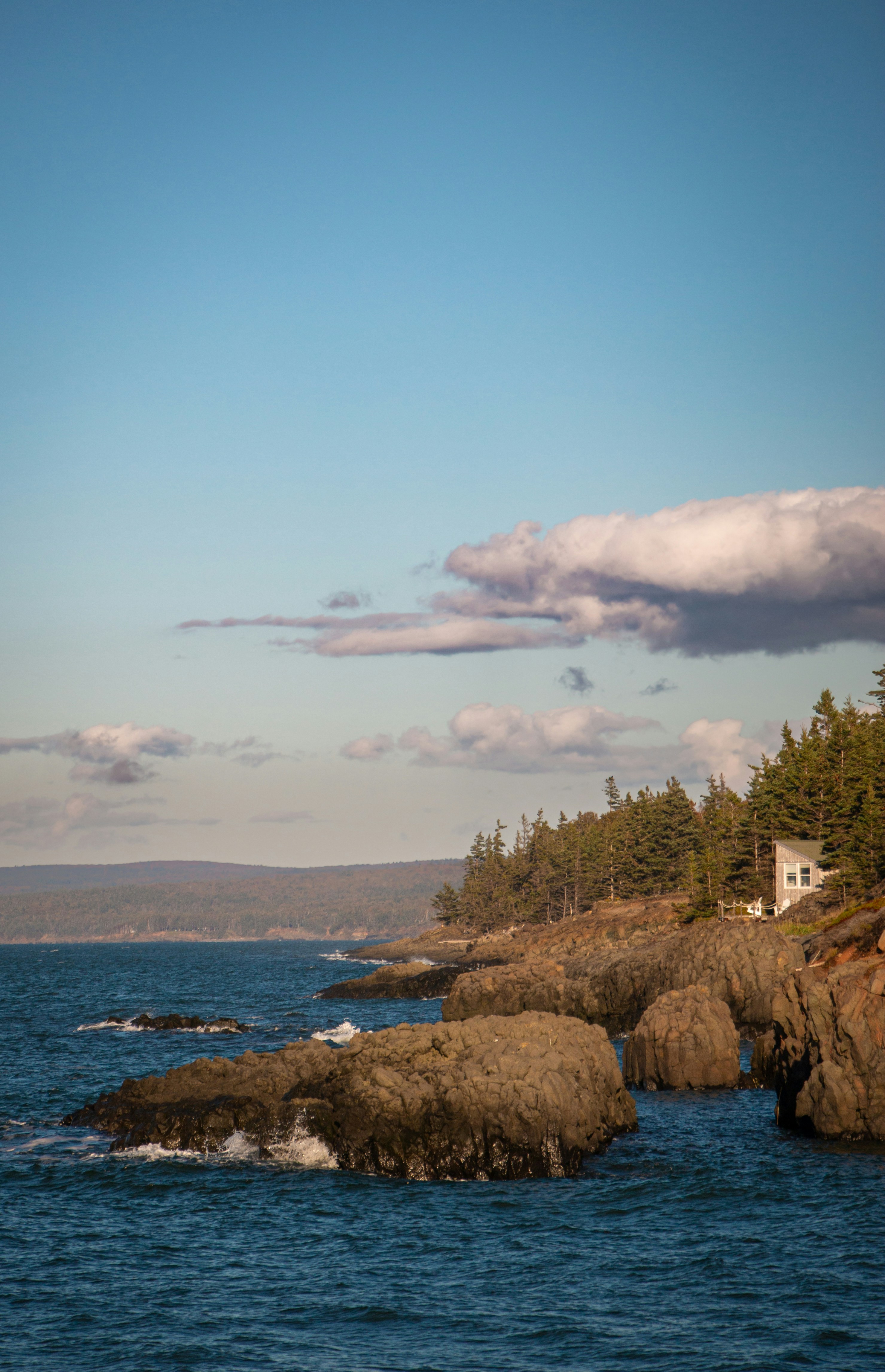 Coastal Cliffline at Dusk: Quiet House at the Edge of the Sea