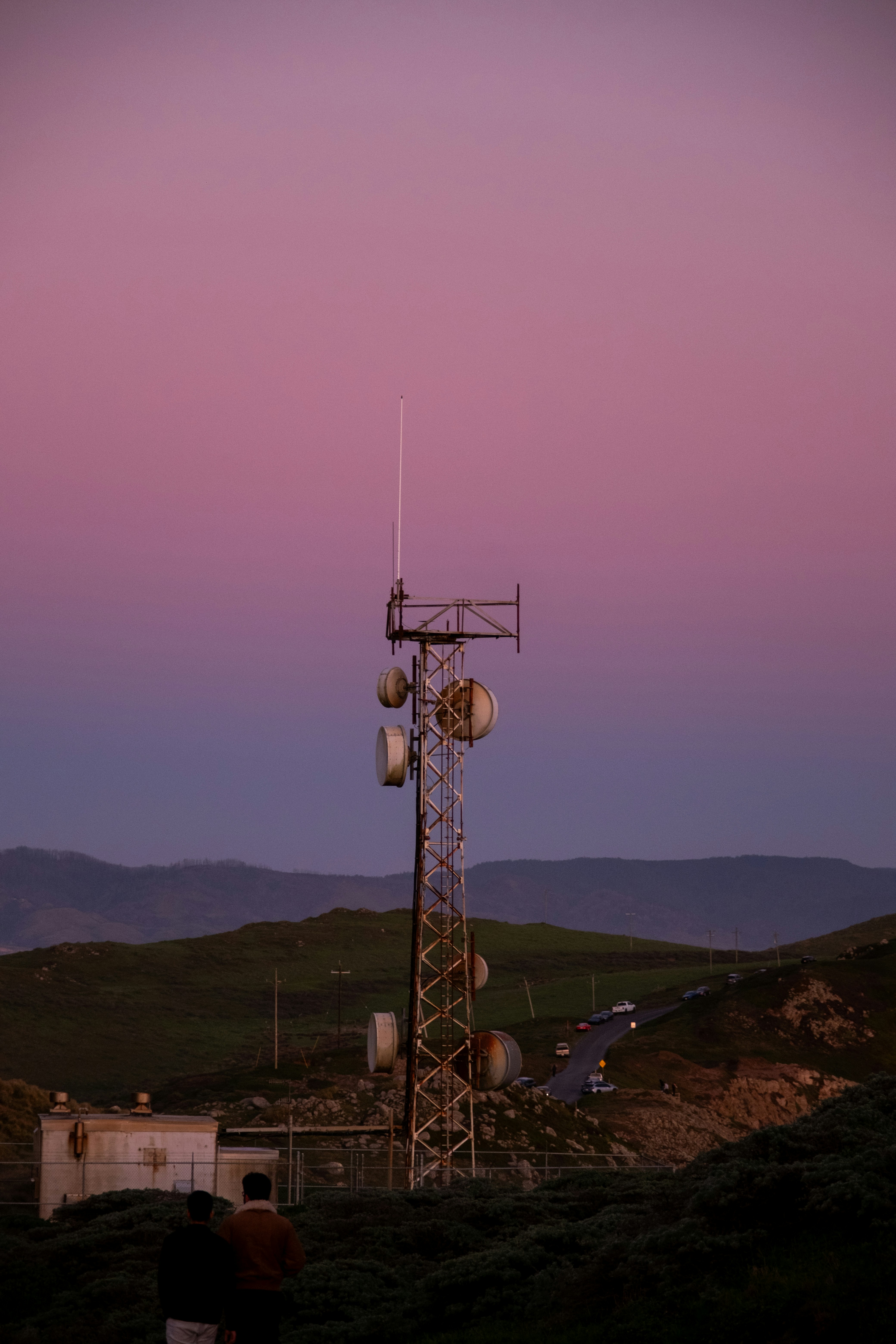 Silhouette Tower at Dusk: Antenna Lights the Quiet Ridge