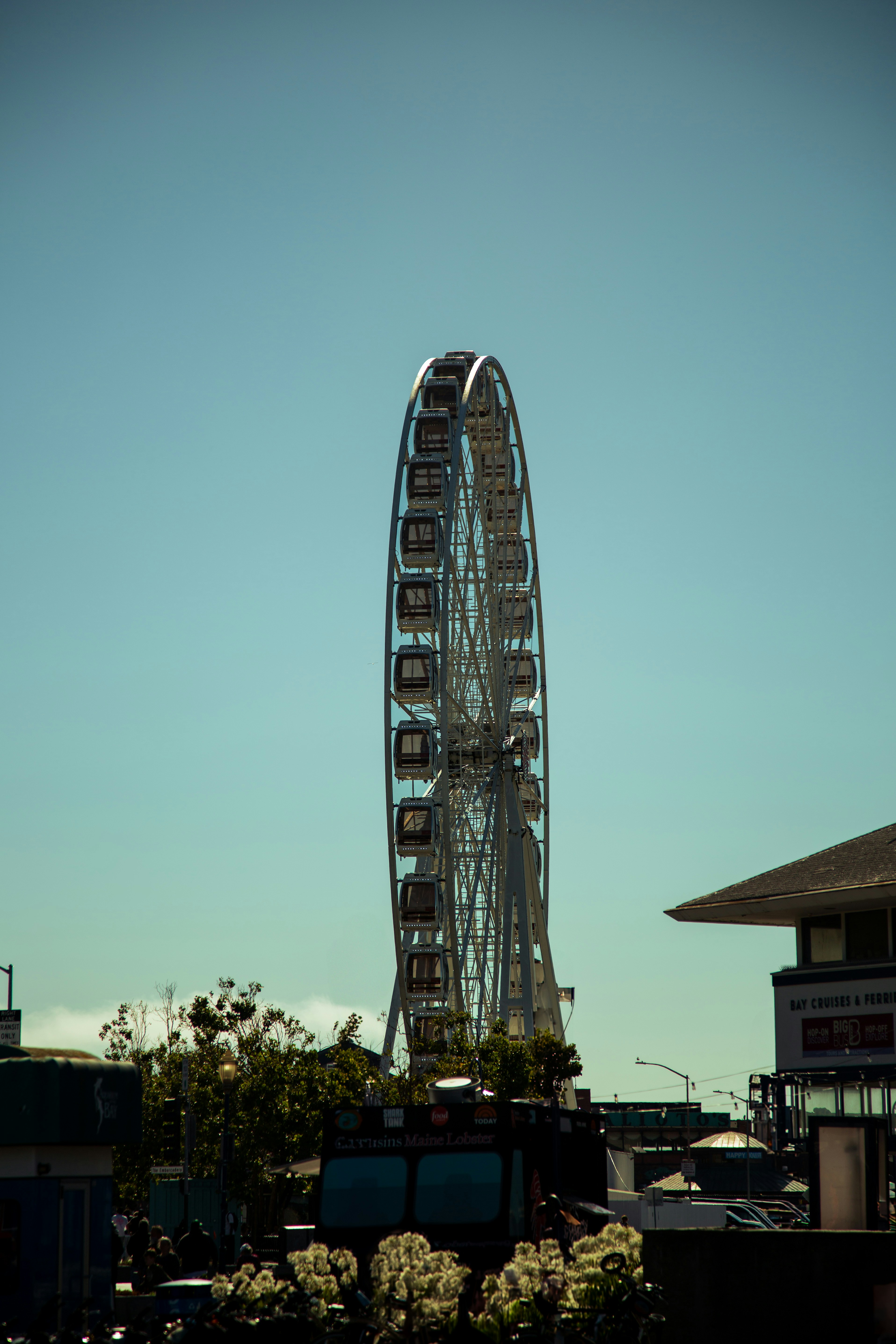 The Blue Hour Wheel: A Ferris Spotlight Over the Pier