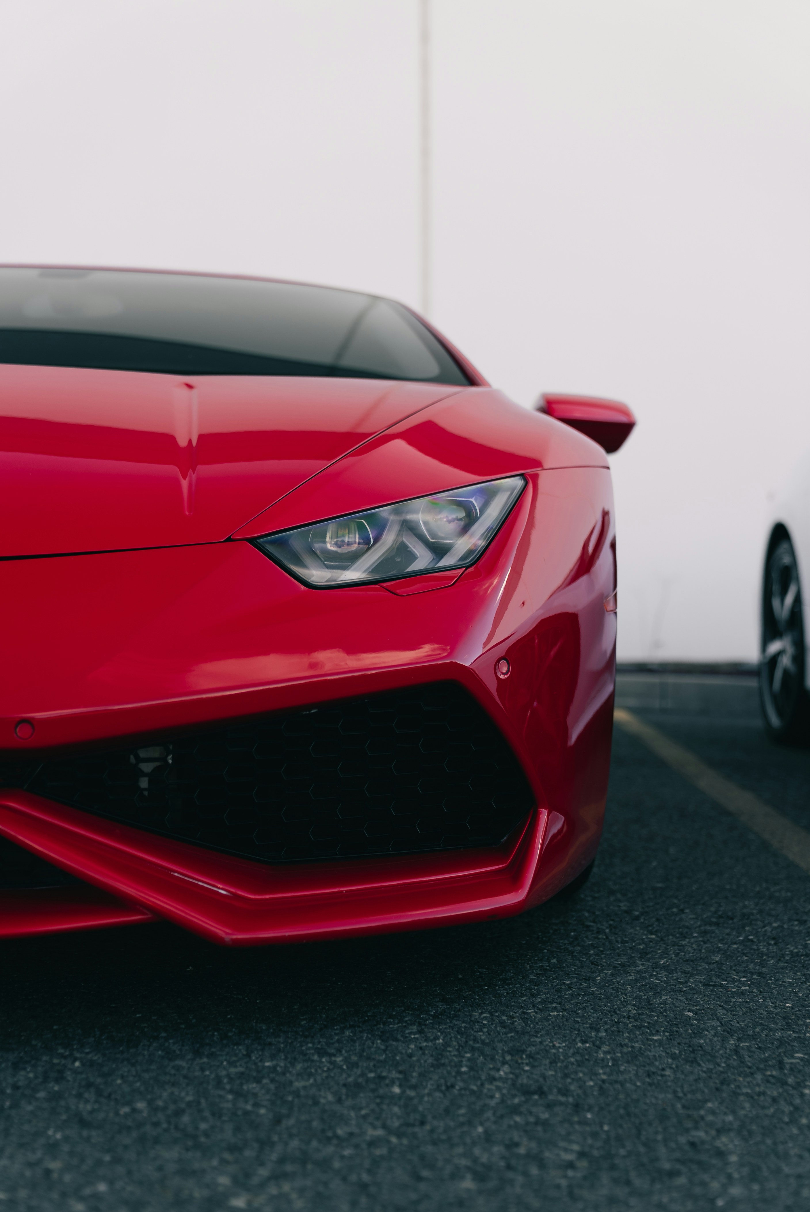 Crimson Apex: Front Quarter of a Red Huracan Feel the Line