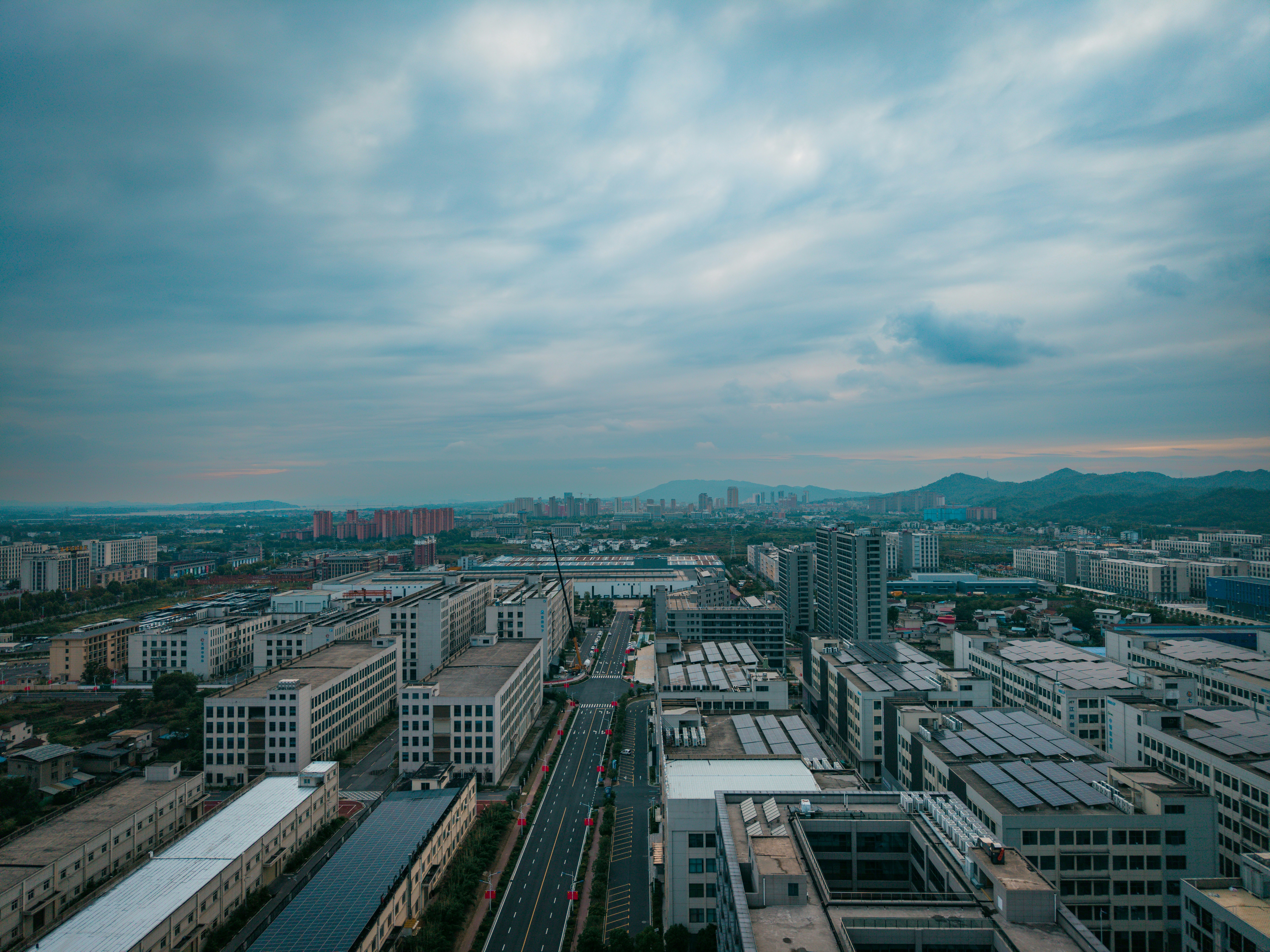 Overcast Cityscape: A Quiet Grid Below Rolling Hills