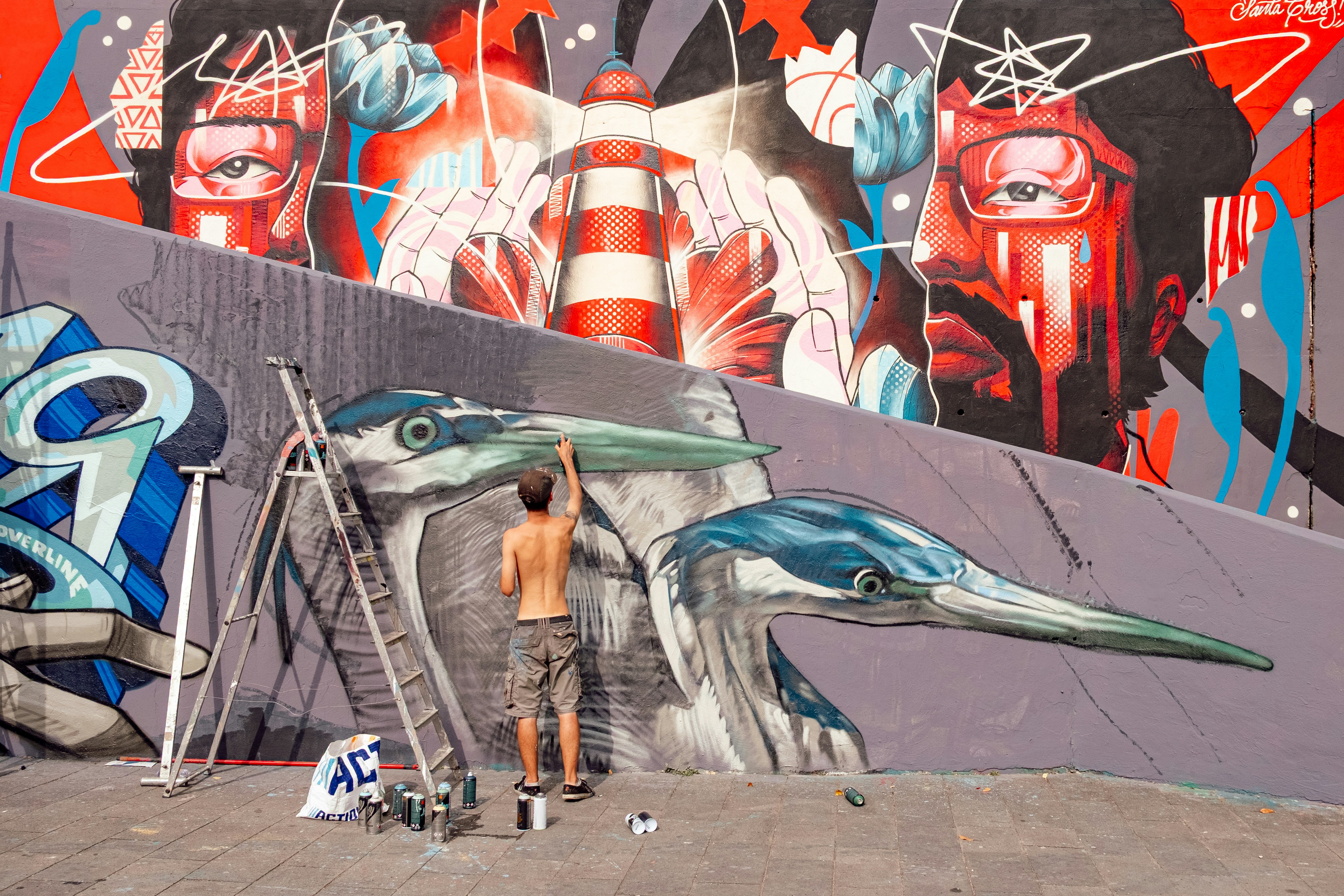 Brushes Below the Beast: A Street Artist Conquers a Grand Façade