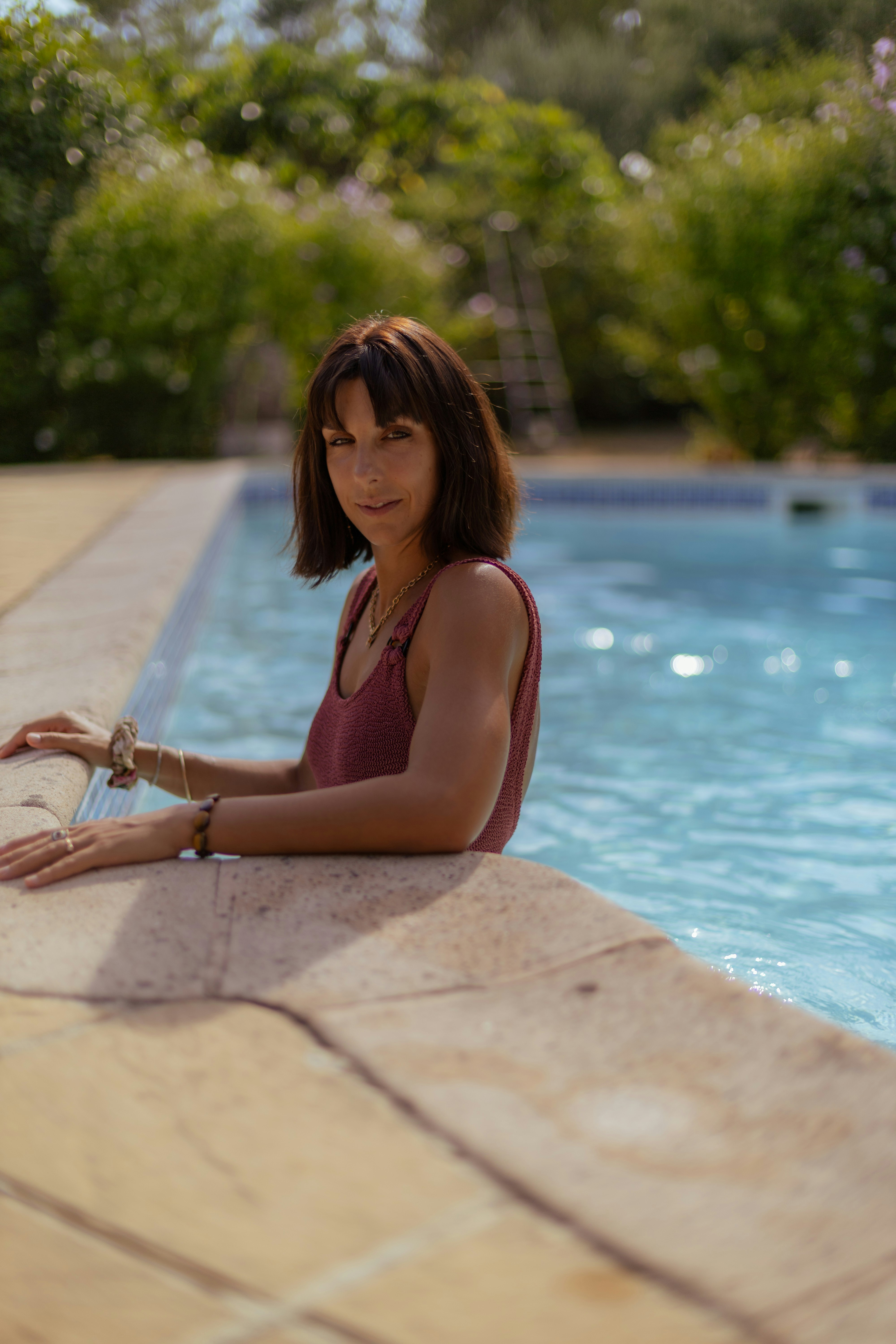 Poolside Resolve: A Calm Portrait by the Water